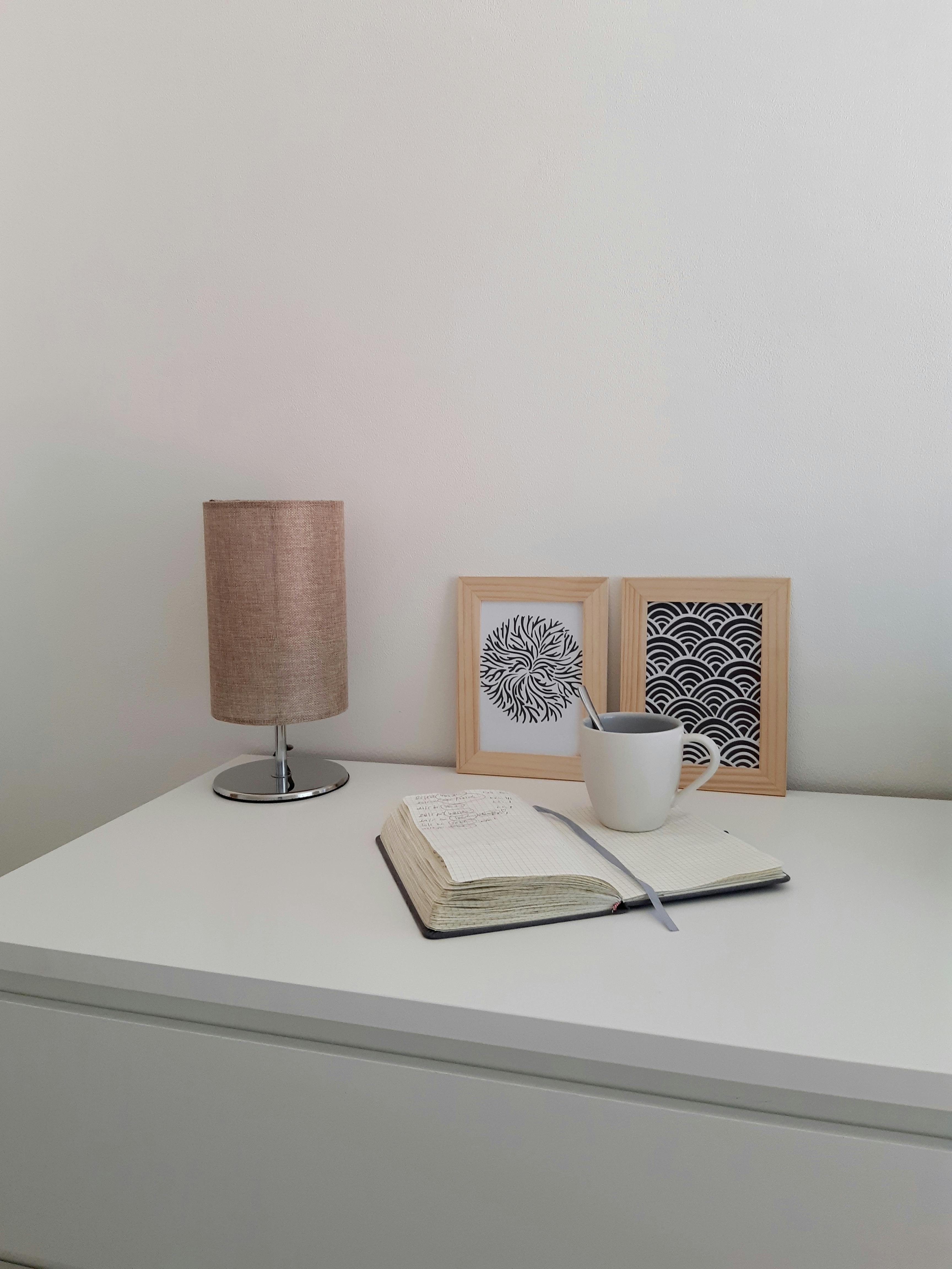 Lamp and Figurine on Night Stand near Bed · Free Stock Photo