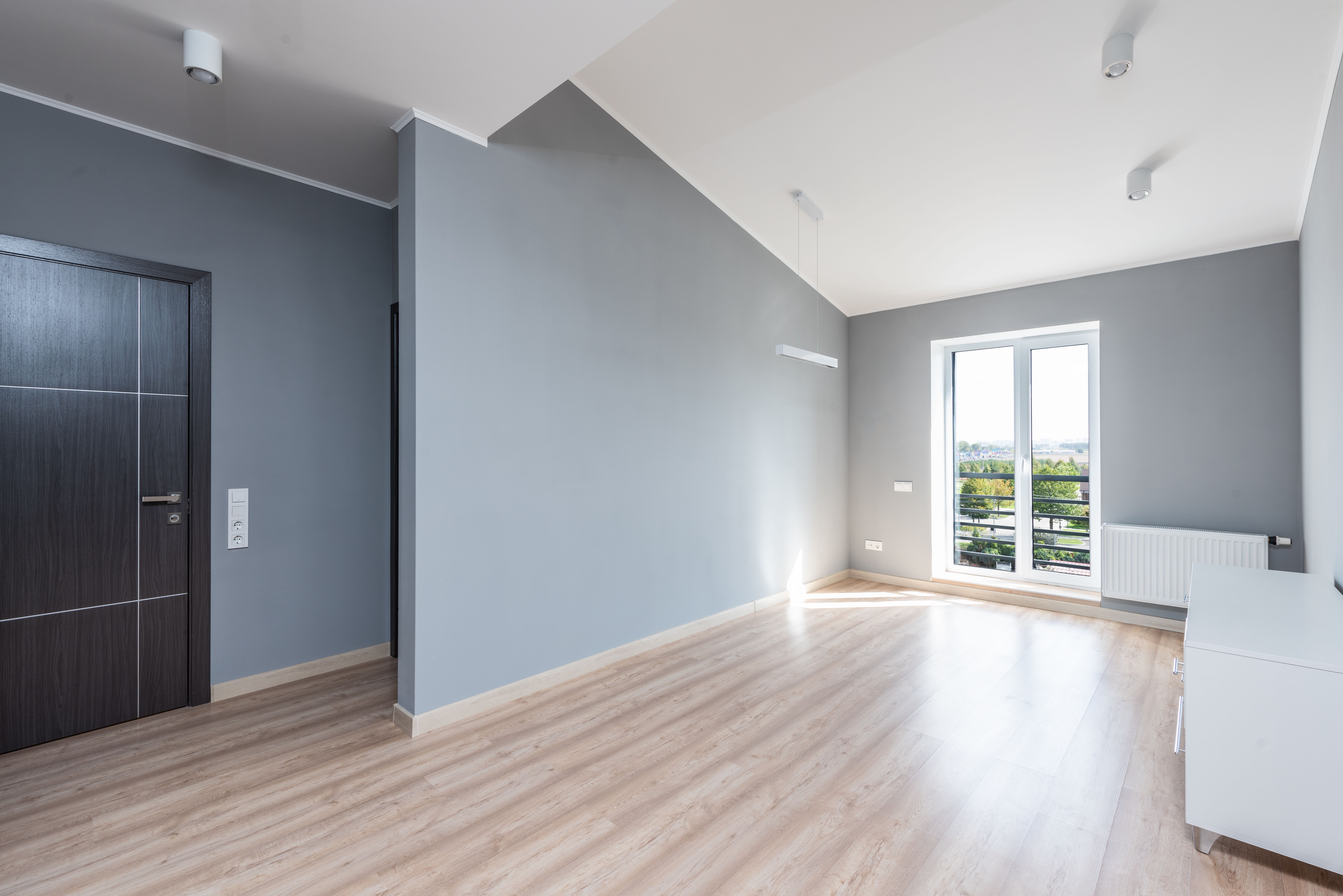 Two Men Measuring Length of the Empty Room with White Walls · Free ...