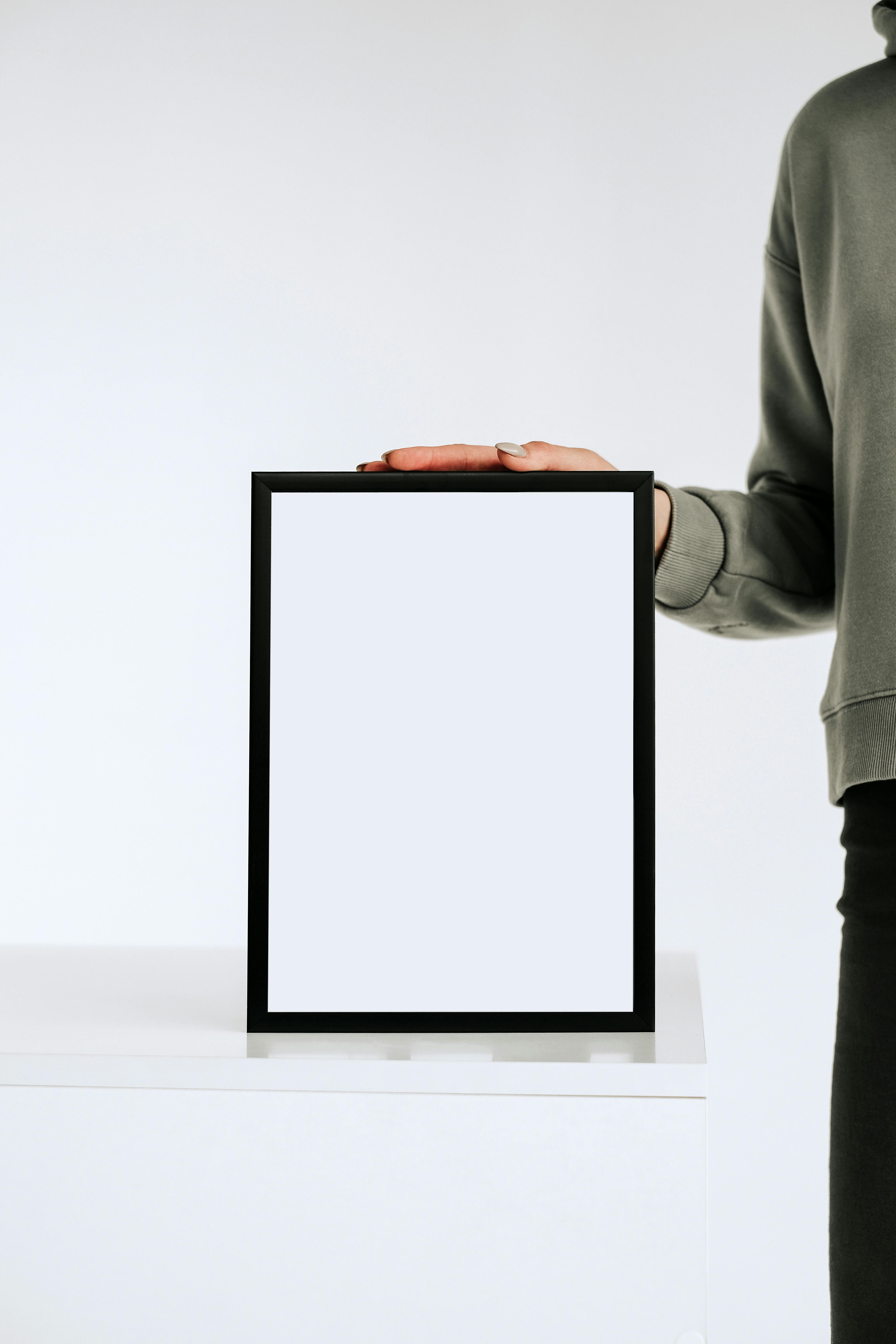 Woman Holding a Frame · Free Stock Photo