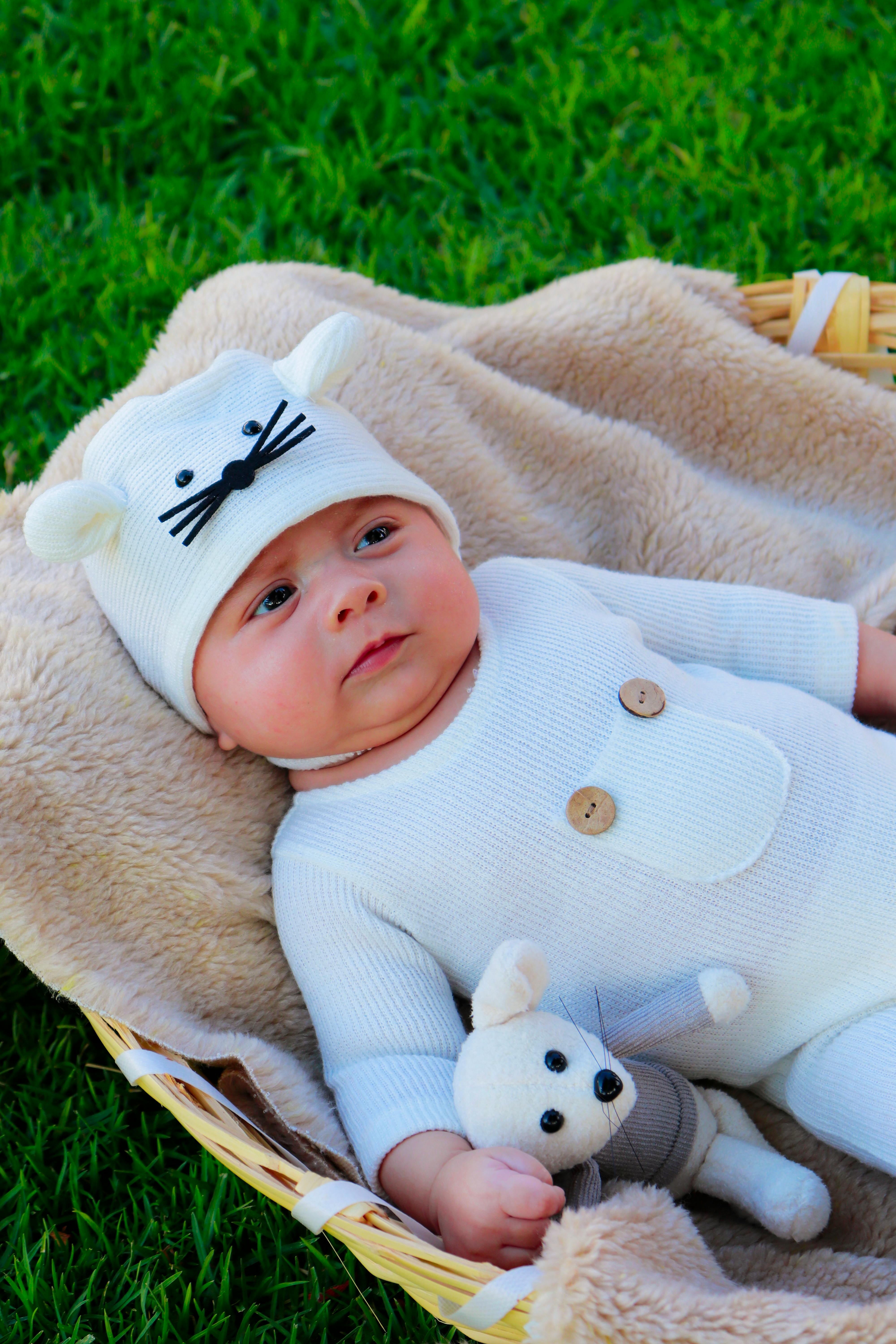 Baby Wearing White Knitted Clothing · Free Stock Photo