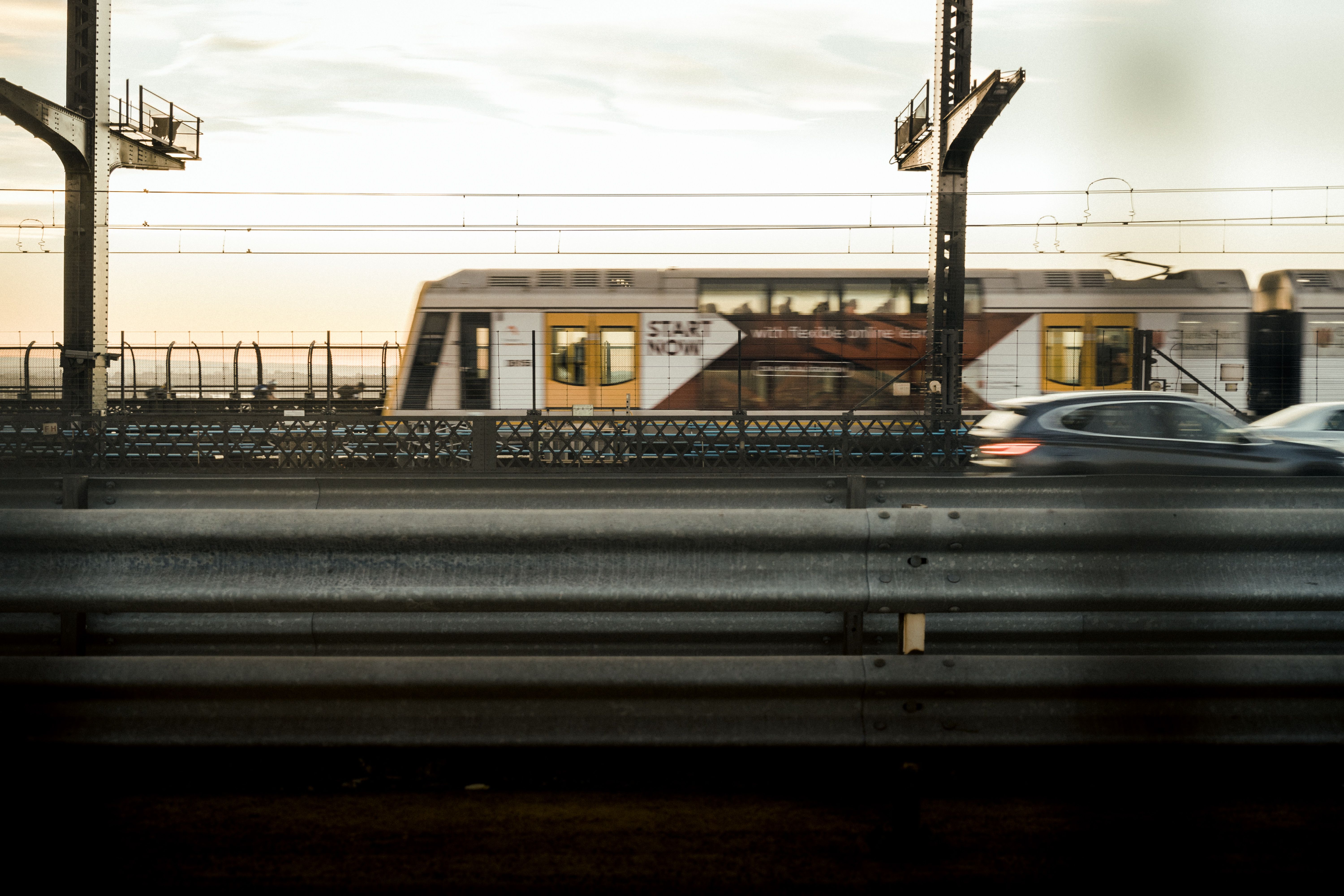 Sun Setting Behind a Moving Subway Train · Free Stock Photo