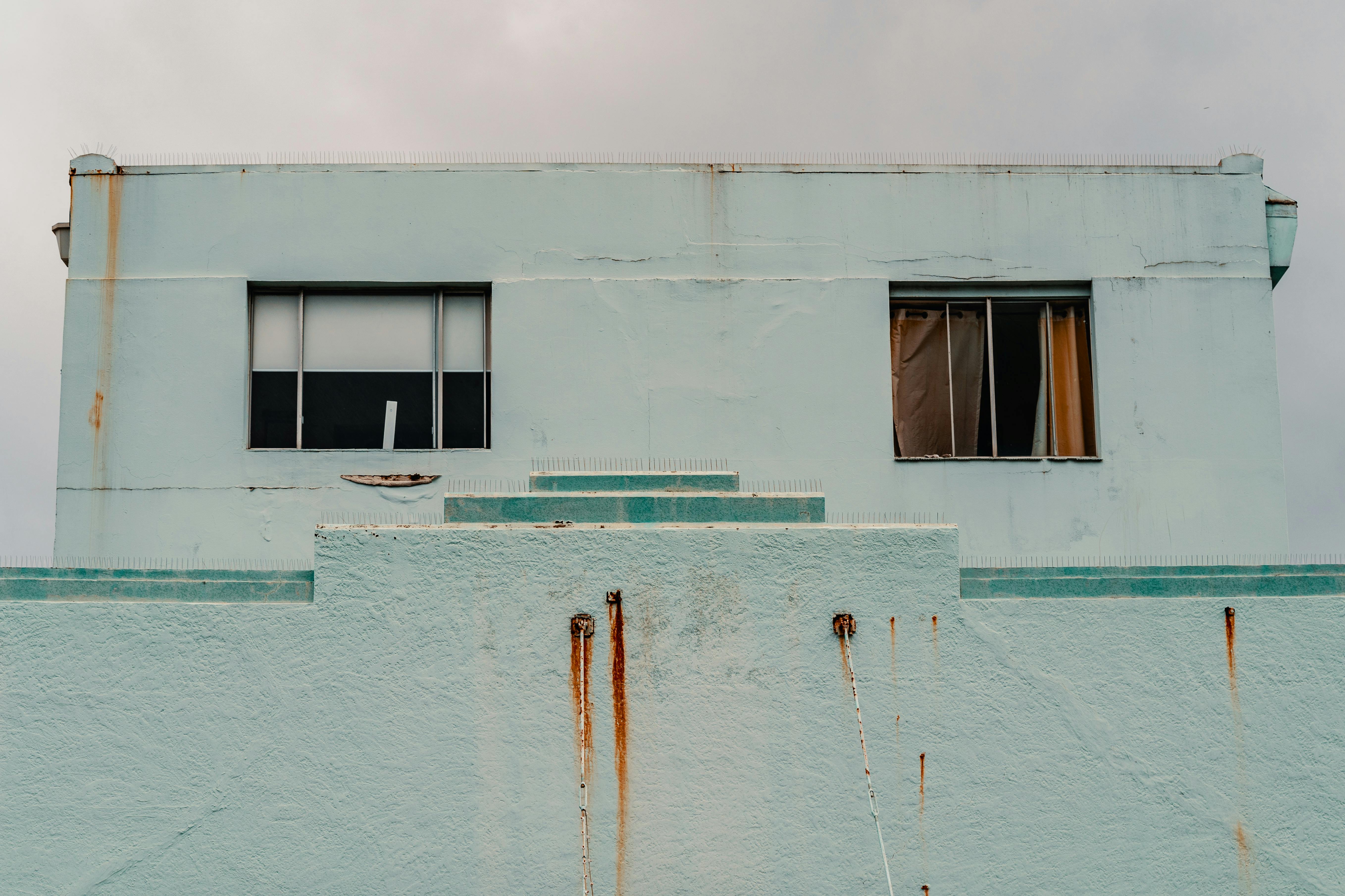 Old Blue Building on White Background · Free Stock Photo