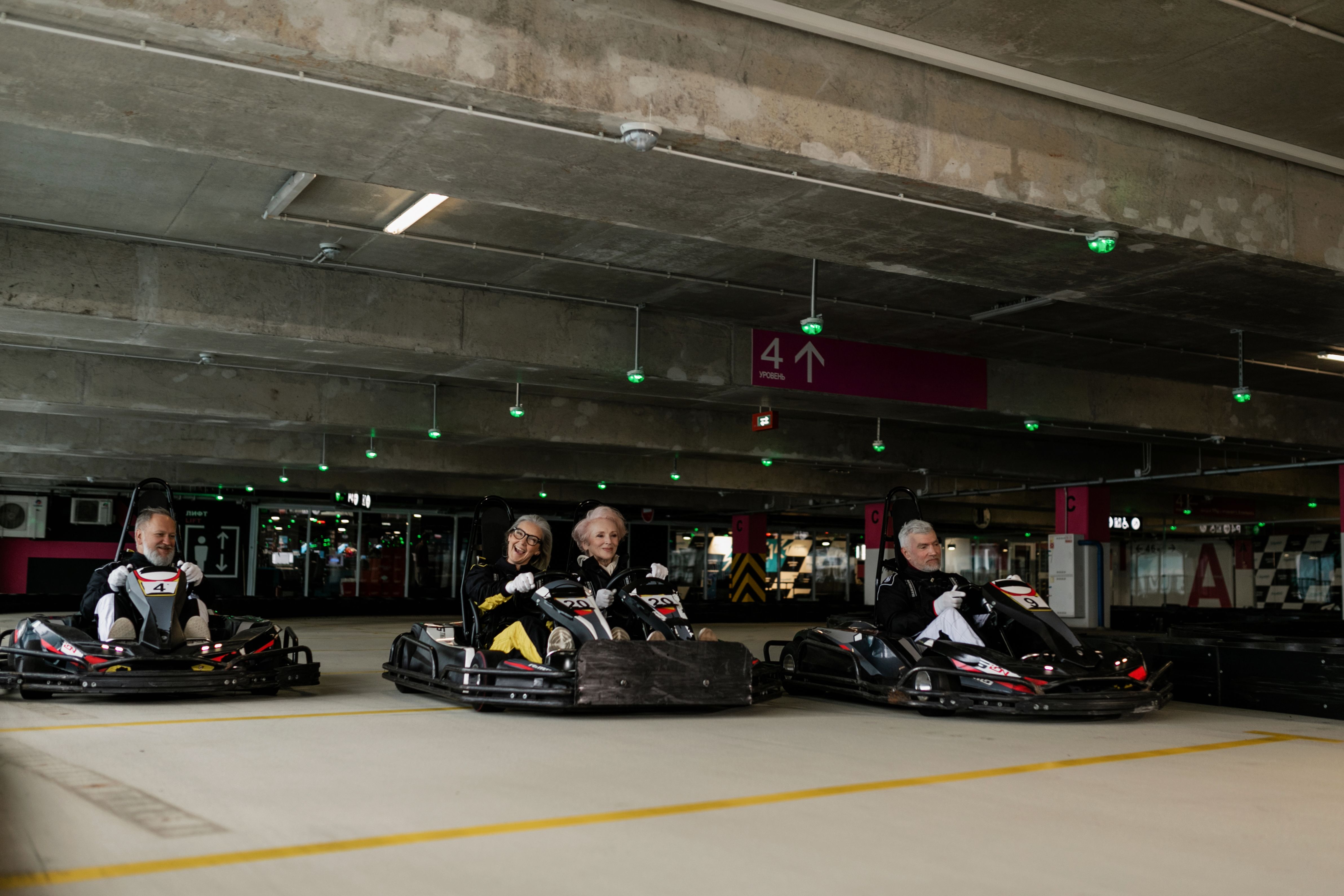 Go-Carts Standing in Line on Speedway · Free Stock Photo