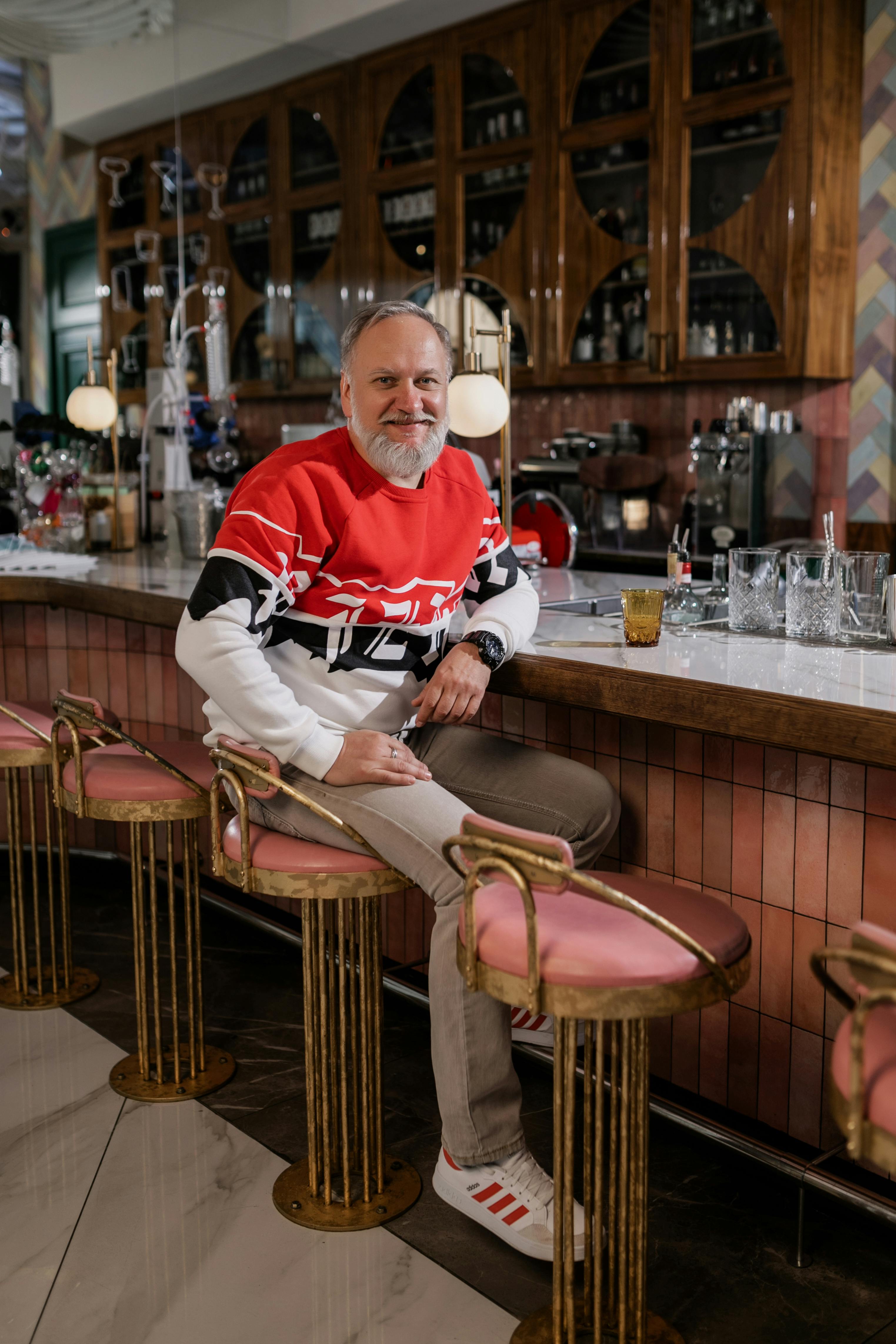 Stylish Elderly Man seating beside Bar Counter · Free Stock Photo