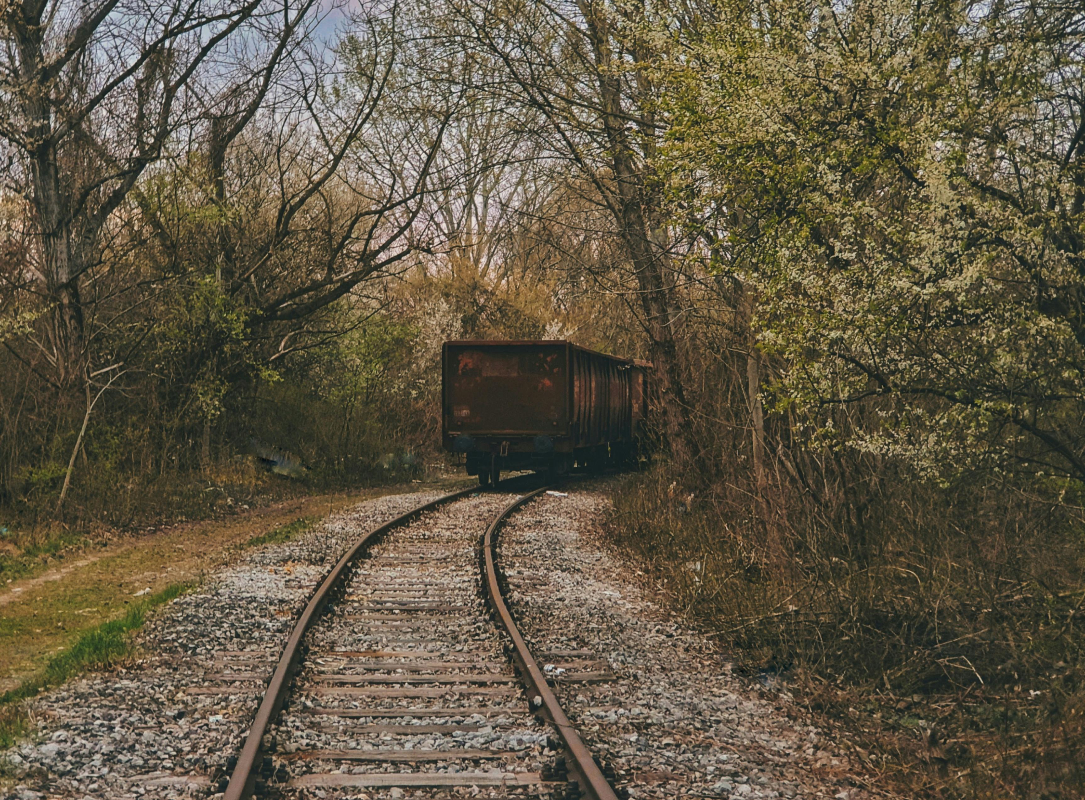 Rusty Train Carriage on a Single Train Track · Free Stock Photo