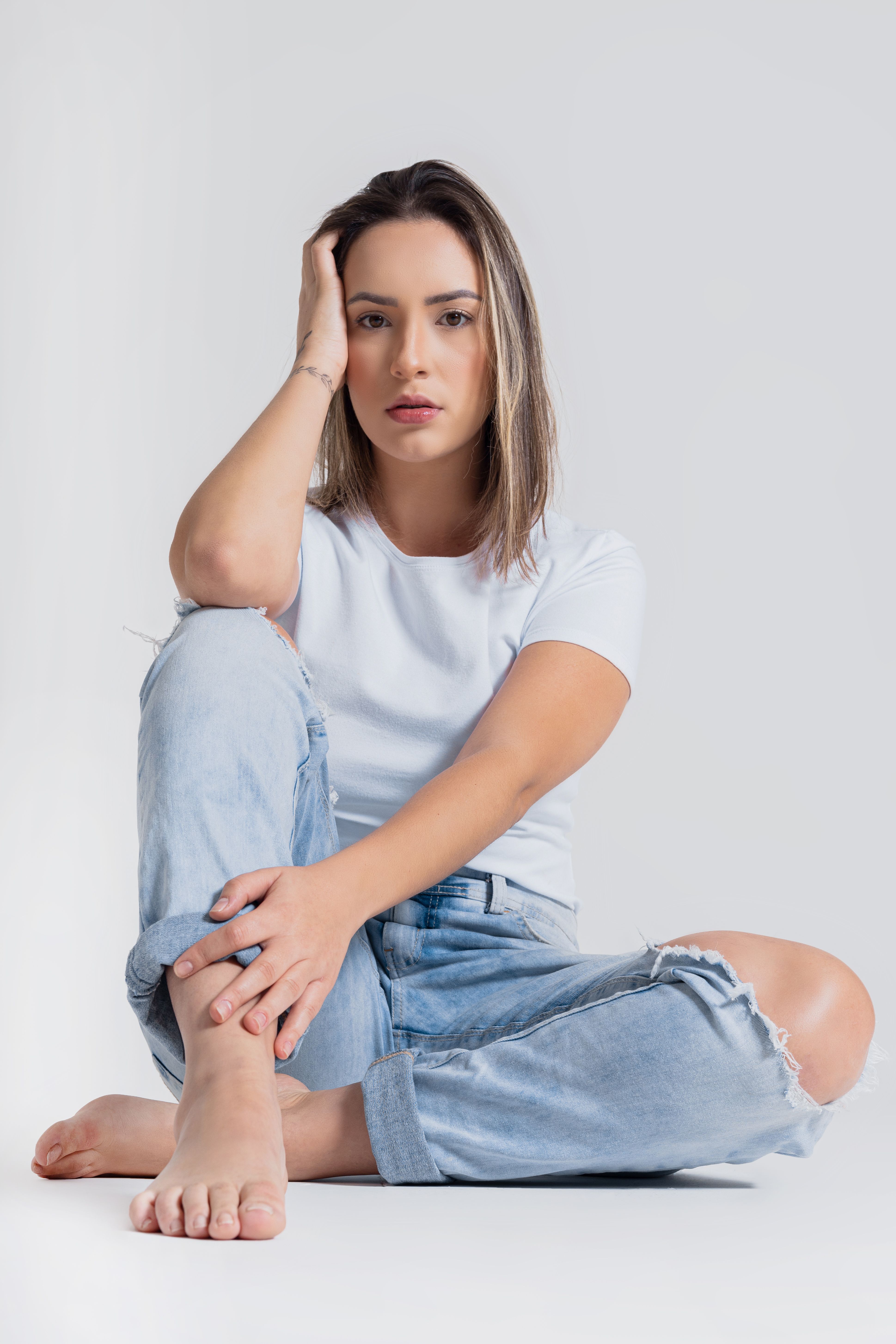 Woman Putting Her Hand to Her Cheek · Free Stock Photo