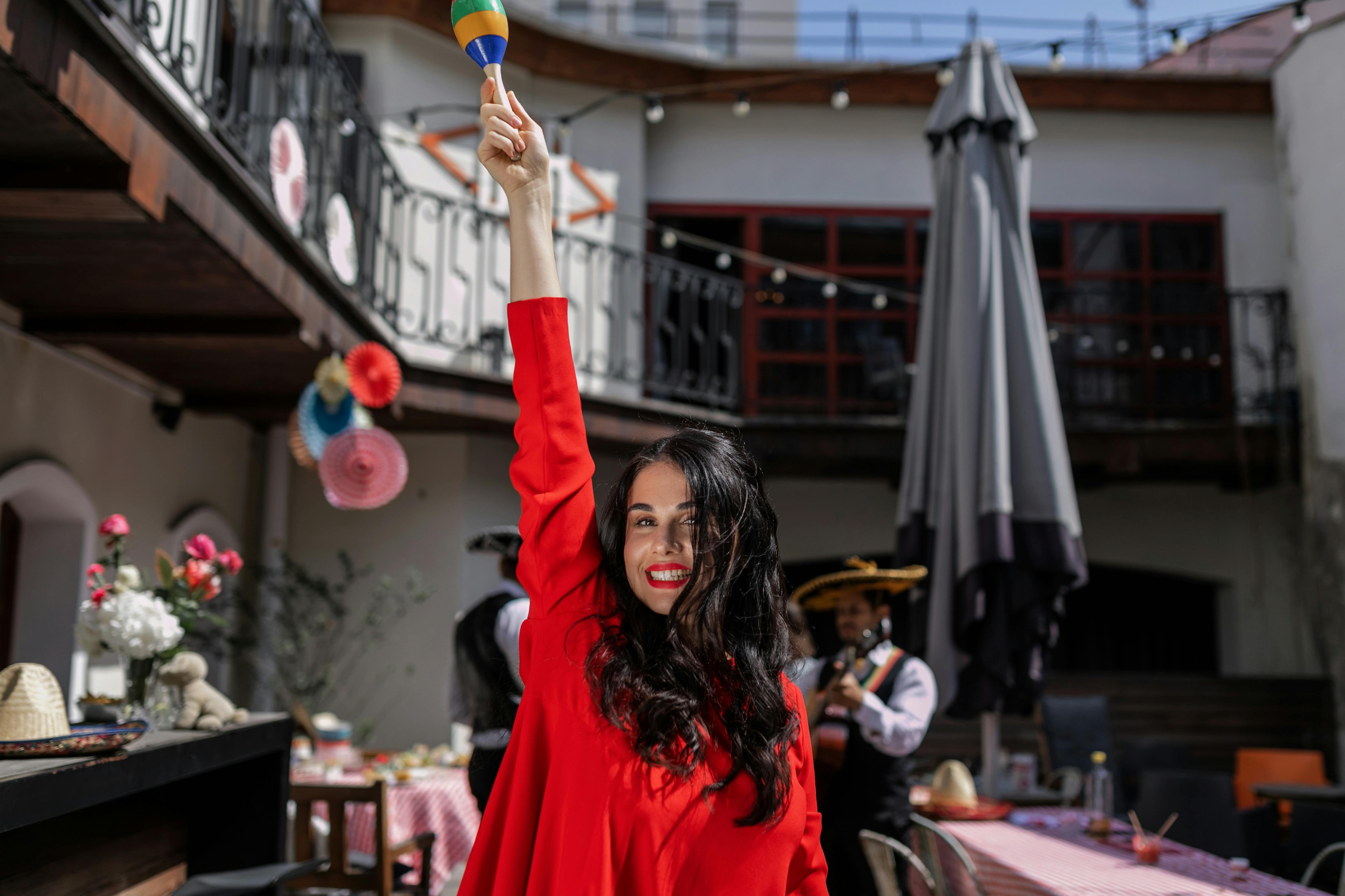 Woman Holding a Maraca · Free Stock Photo
