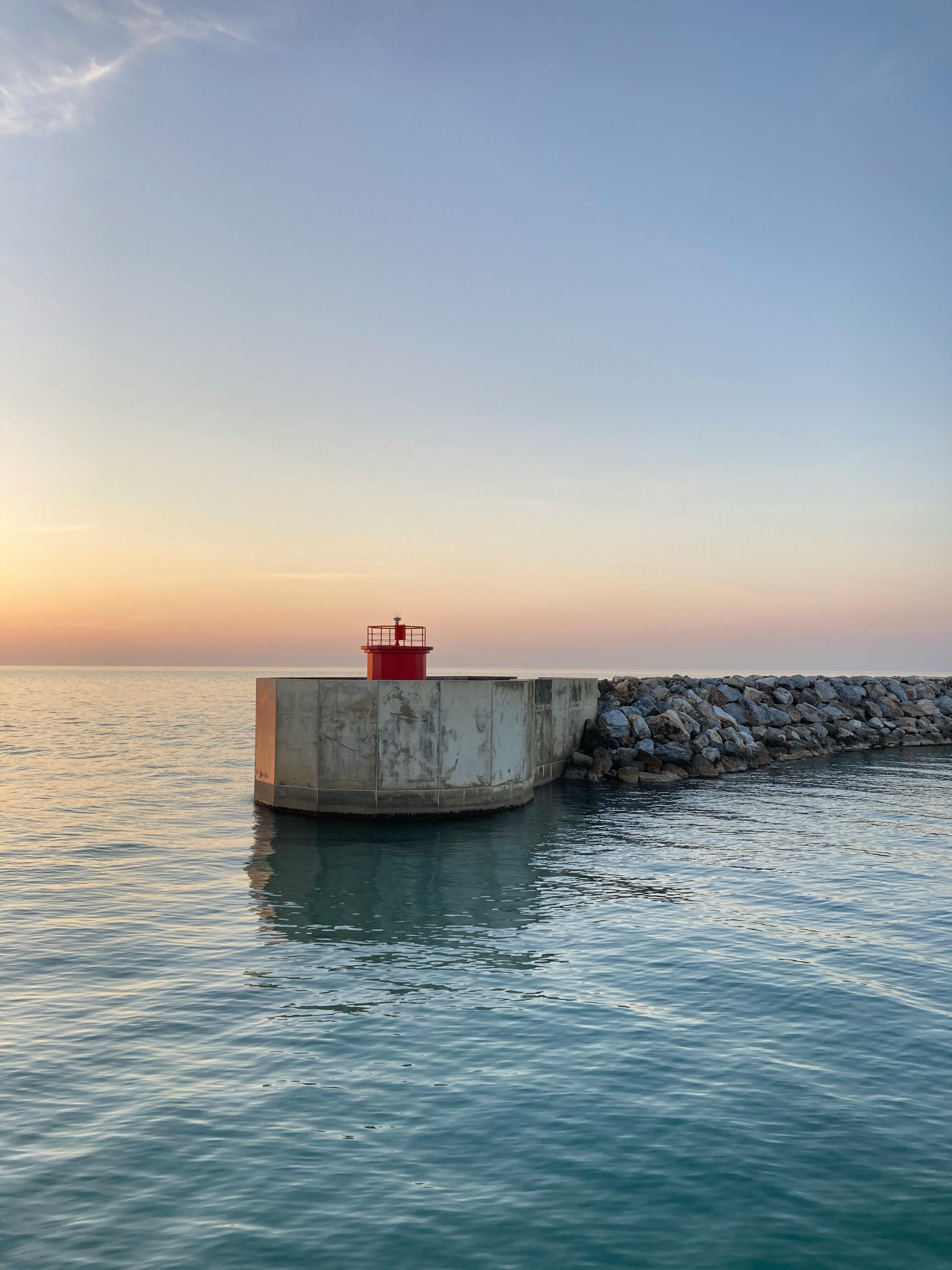 Jetty With a Beacon at Dusk · Free Stock Photo