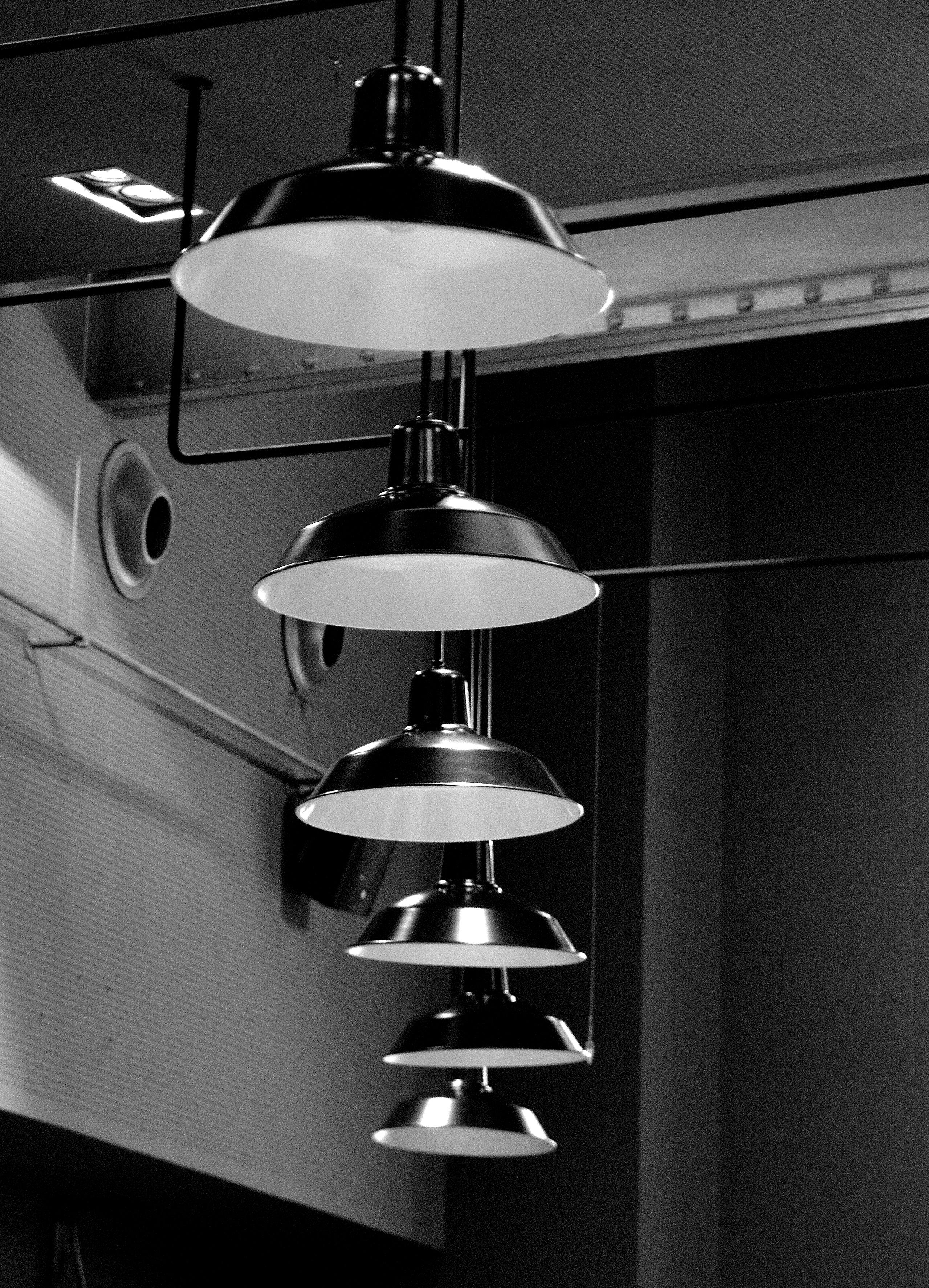 A Green Signage Above a White Pendant Lamp · Free Stock Photo