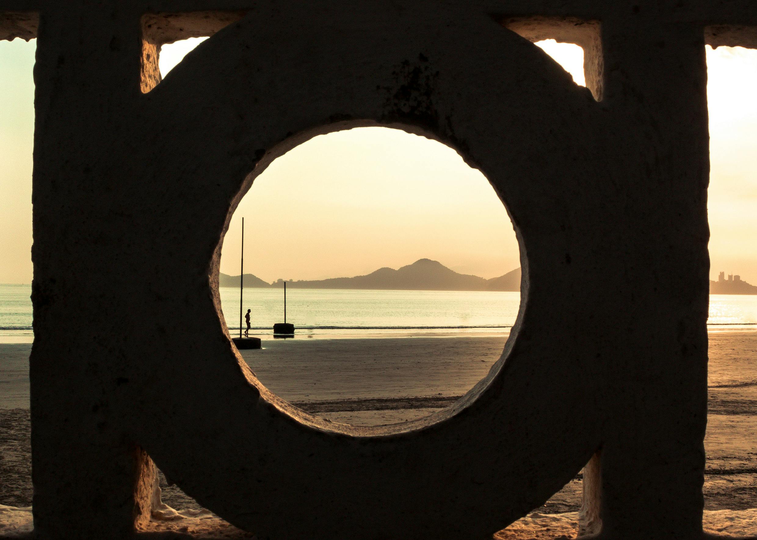 Sea View from Hole on Round Stone · Free Stock Photo