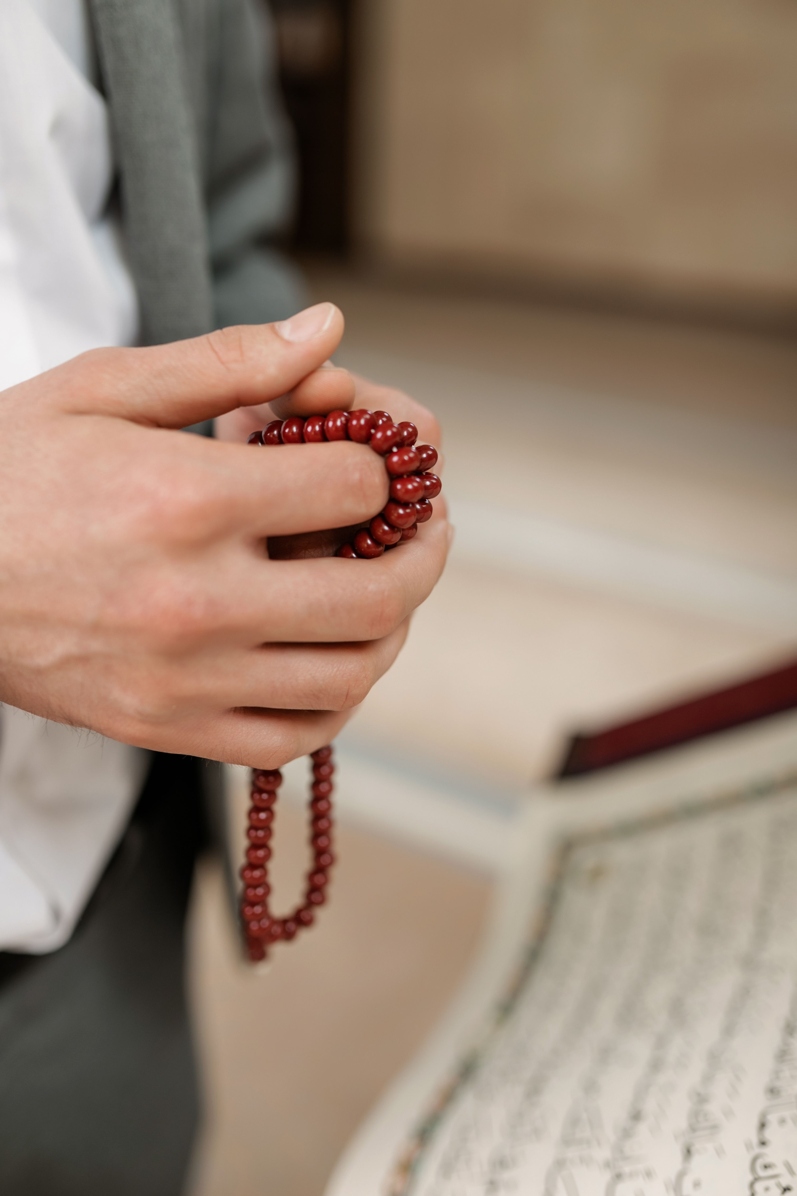 Man Holding a Misbah and Reading from a Muslim Prayer Book · Free Stock ...