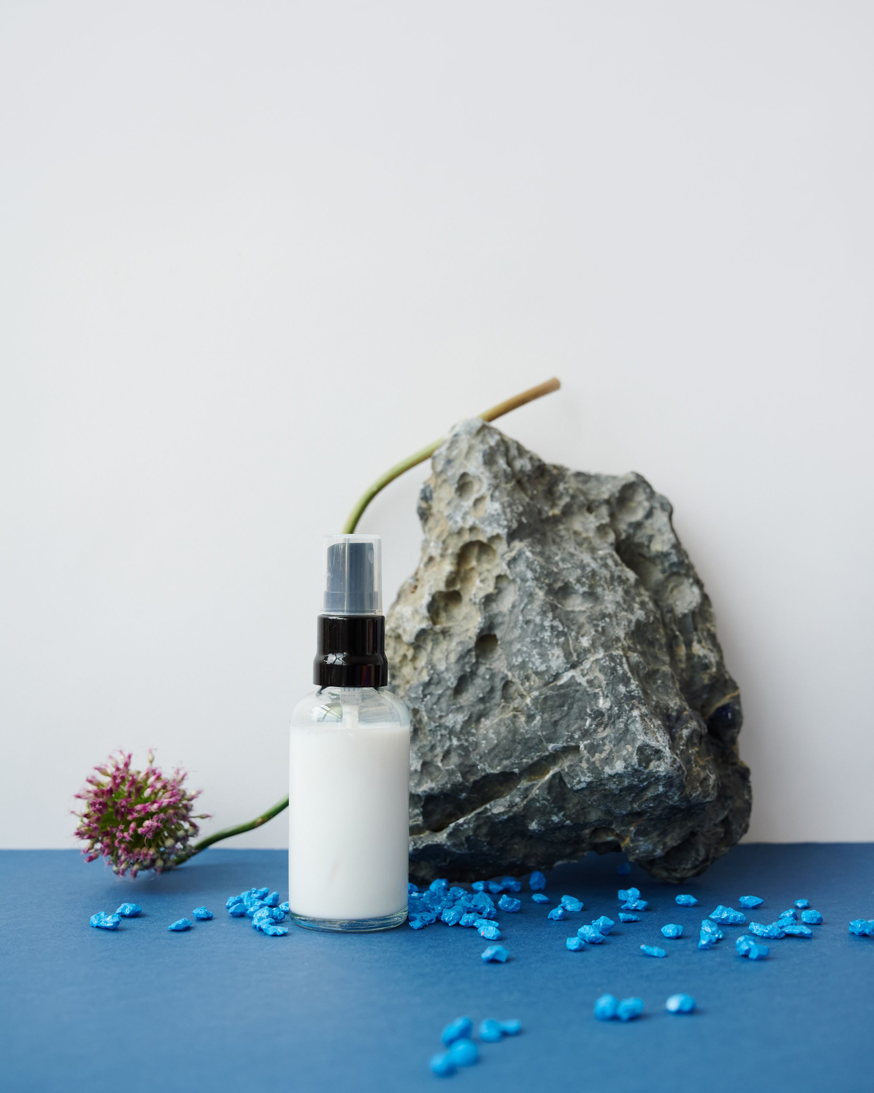 Spray Bottle with a White Liquid Inside · Free Stock Photo