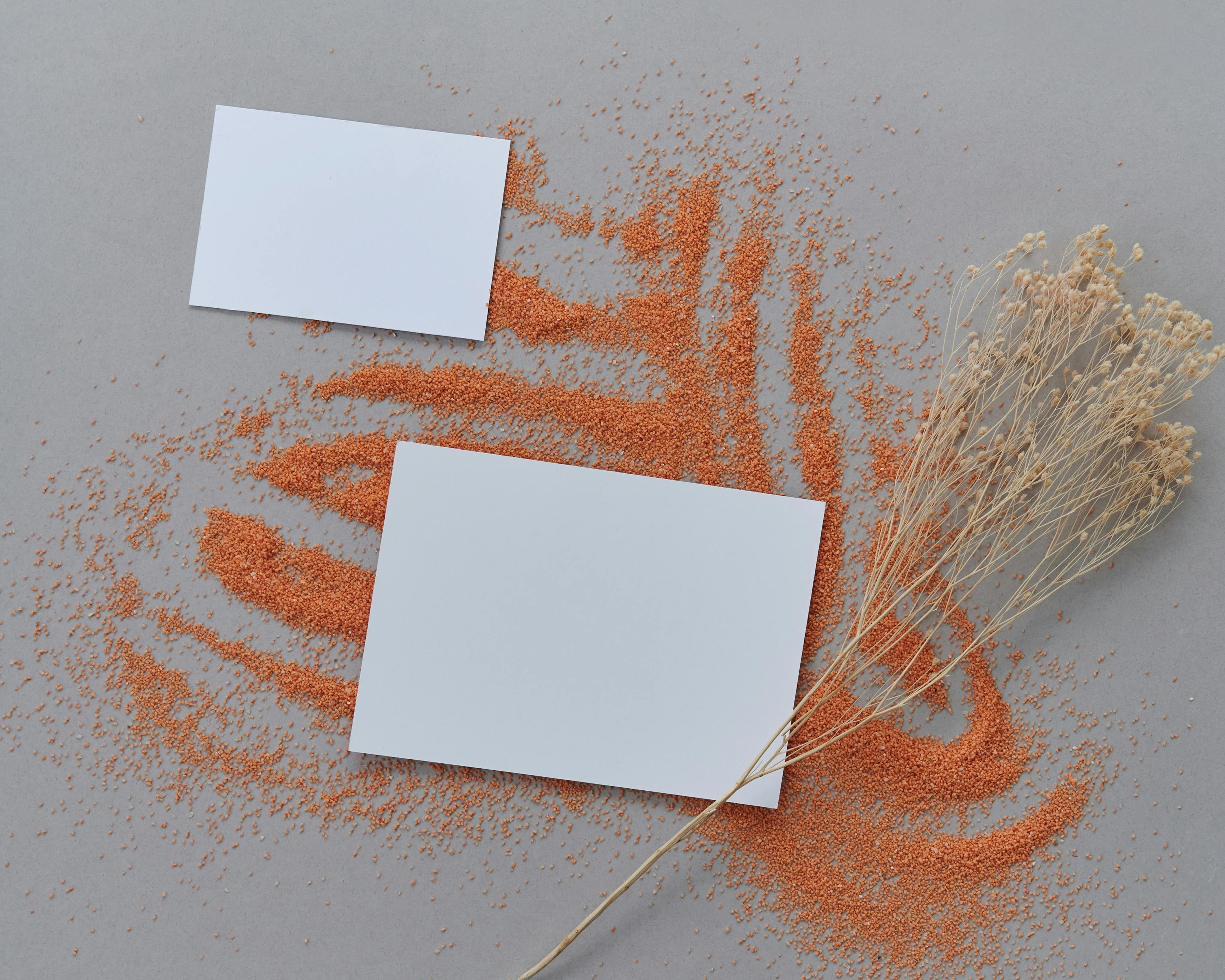 Blank Pieces of Paper on Scattered Orange Powder and a Dry Flower ...