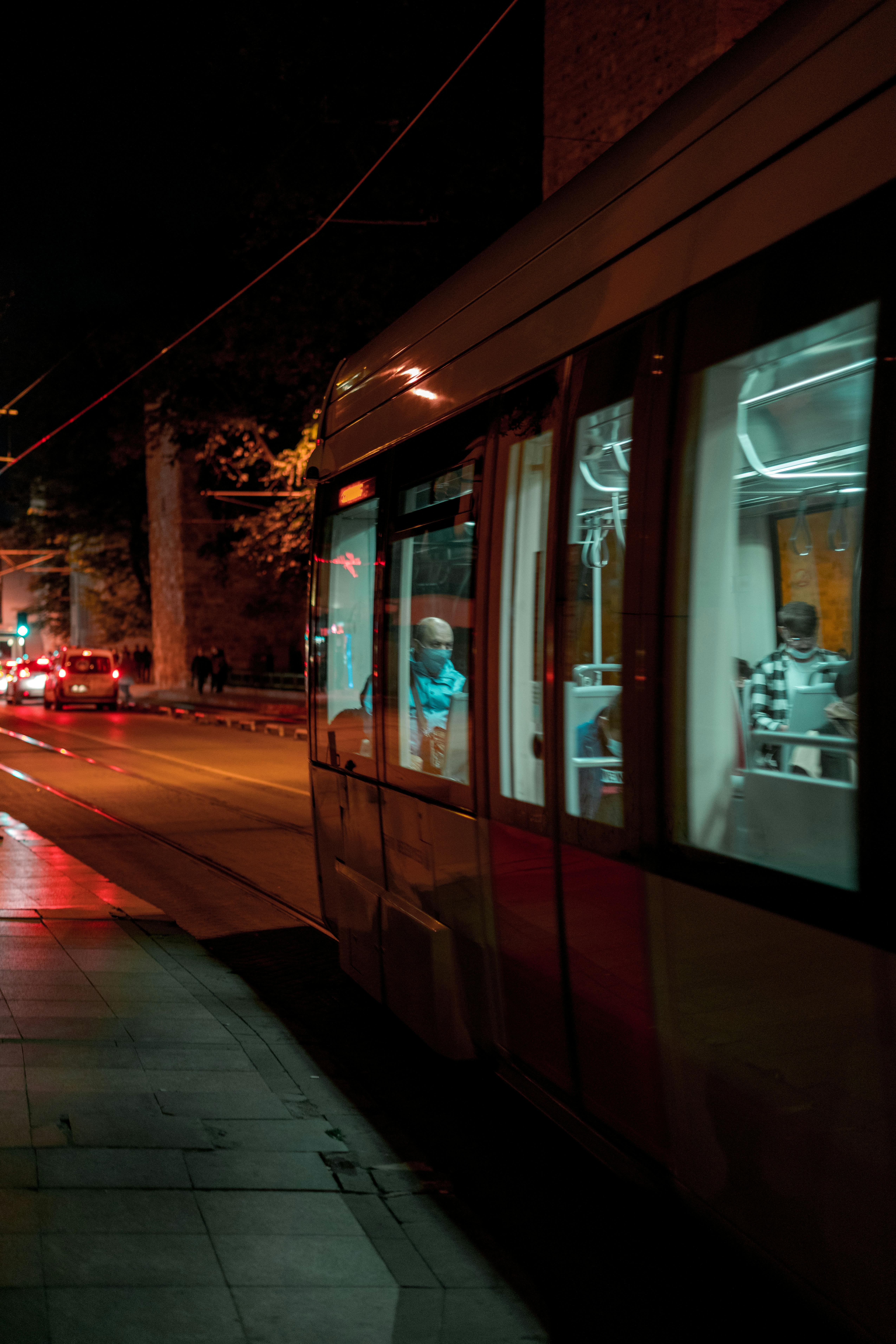 Man Standing Inside Train Waiting to Stop · Free Stock Photo