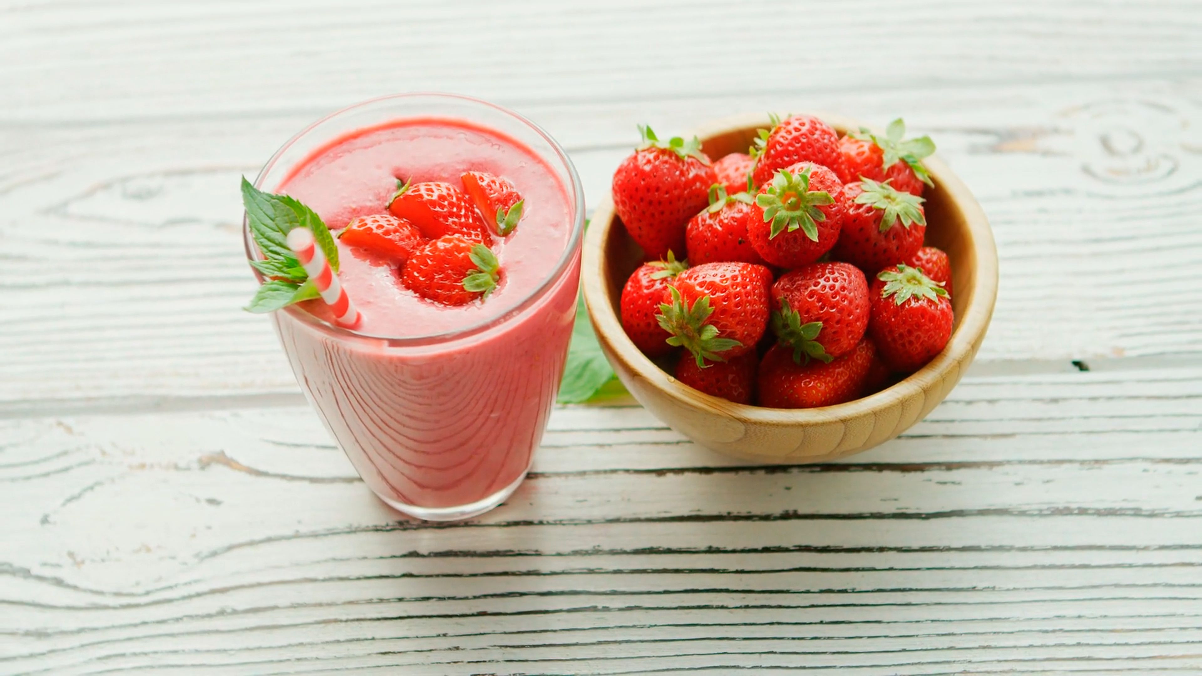 Smoothie Decorated with Strawberry Slices and Flowers · Free Stock Photo
