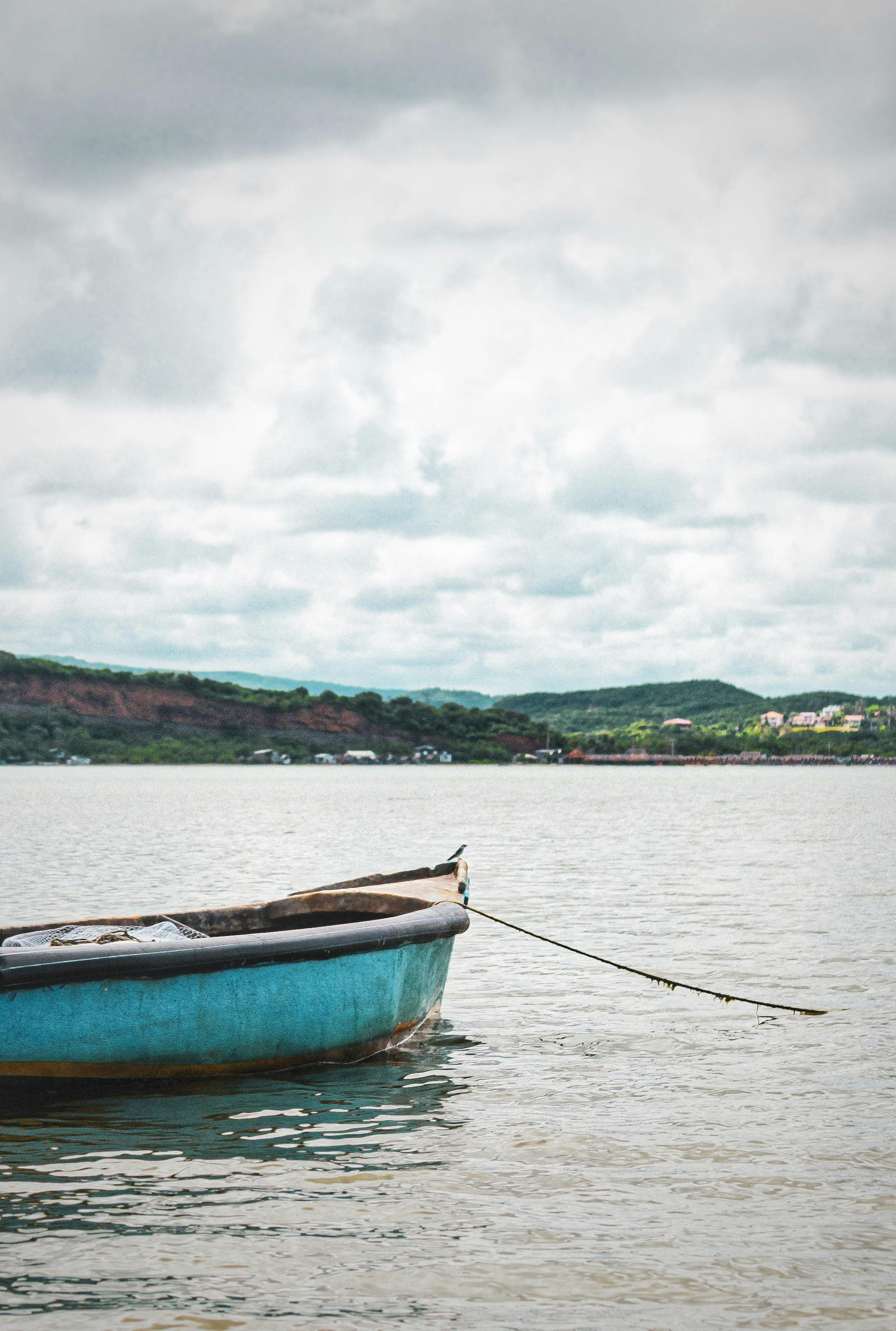 A Boat Floating on the Sea · Free Stock Photo