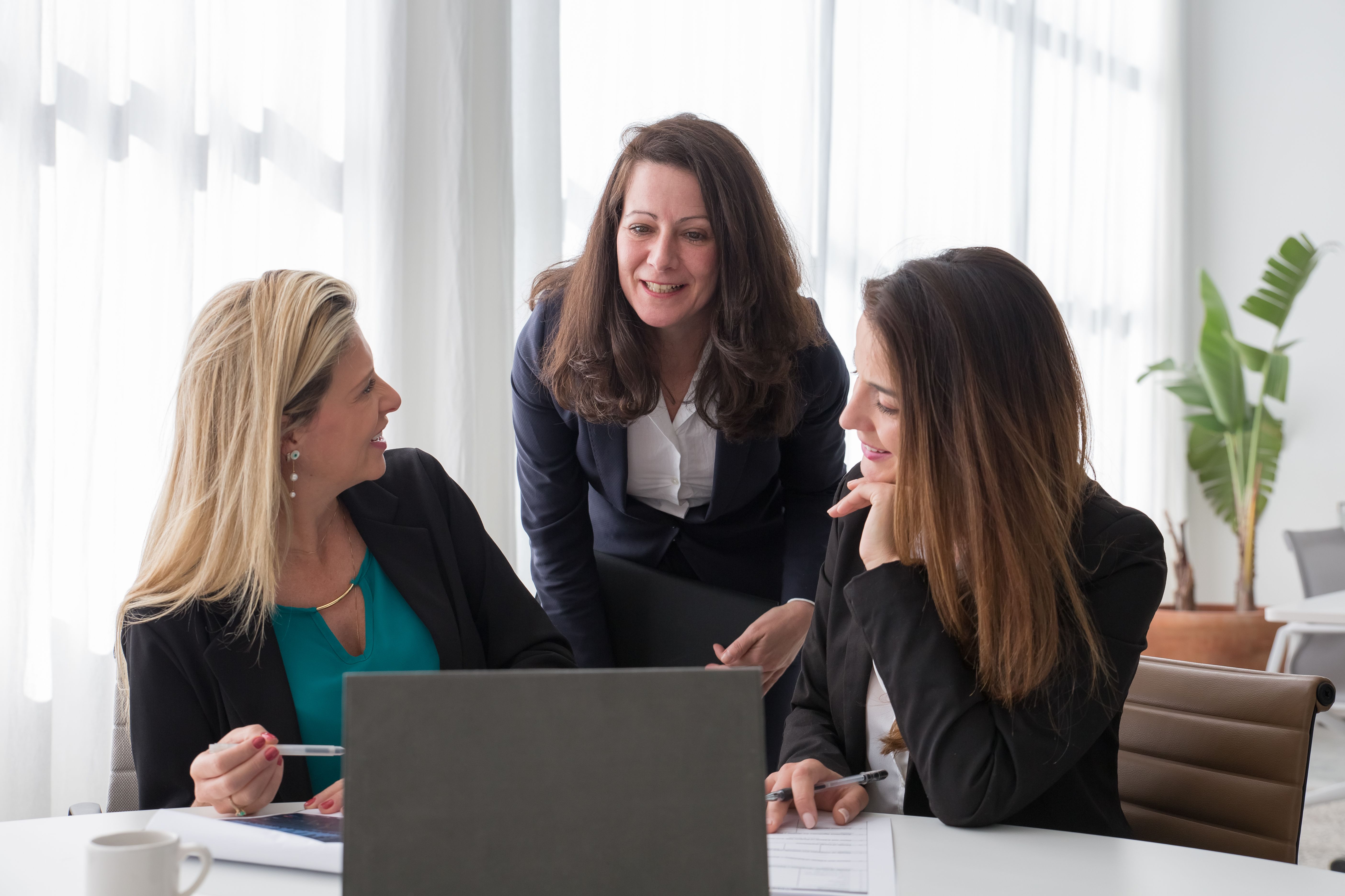 Women in Blazers Working in an Office · Free Stock Photo