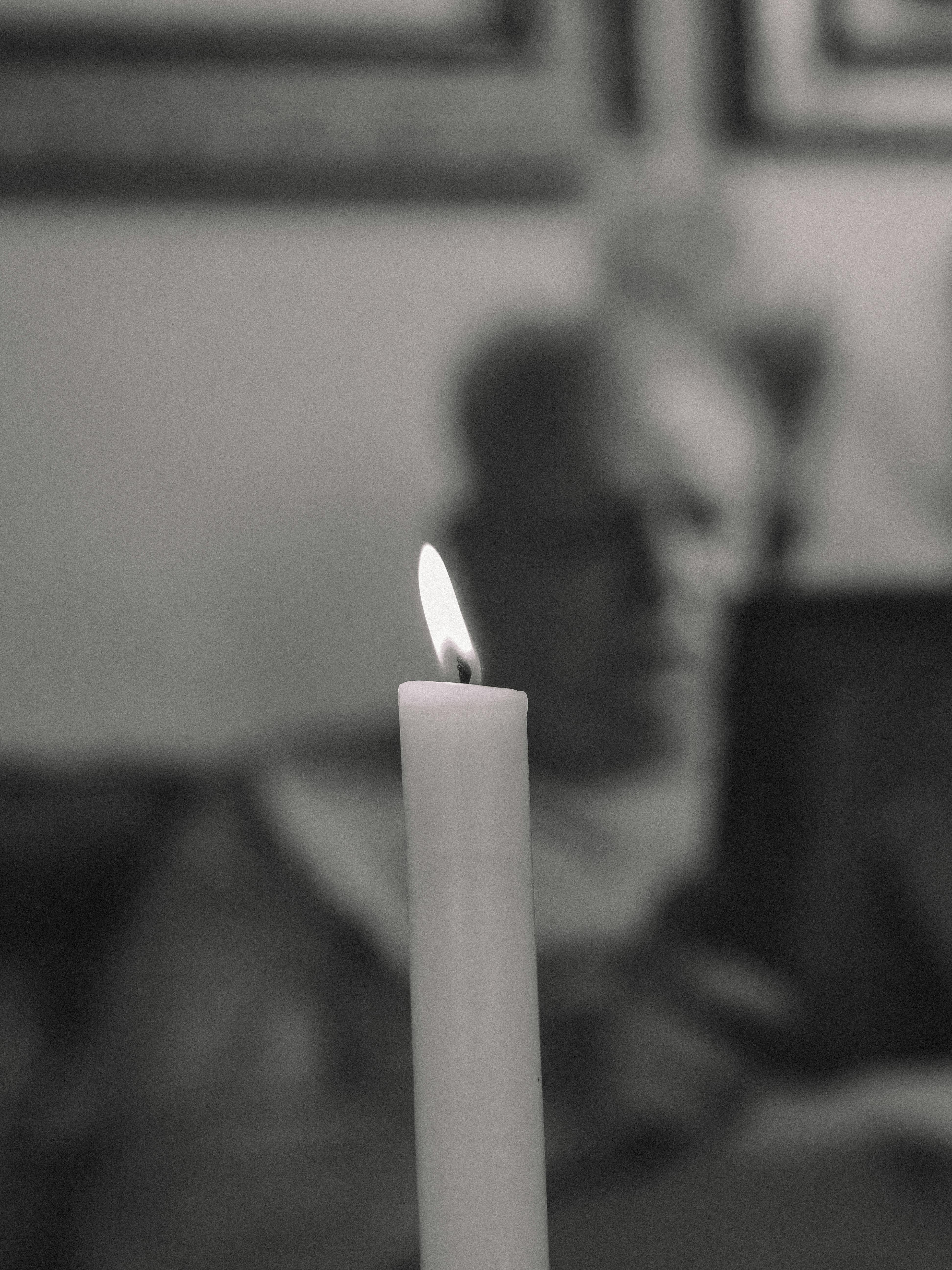 Grayscale Photo of Burning Candle · Free Stock Photo