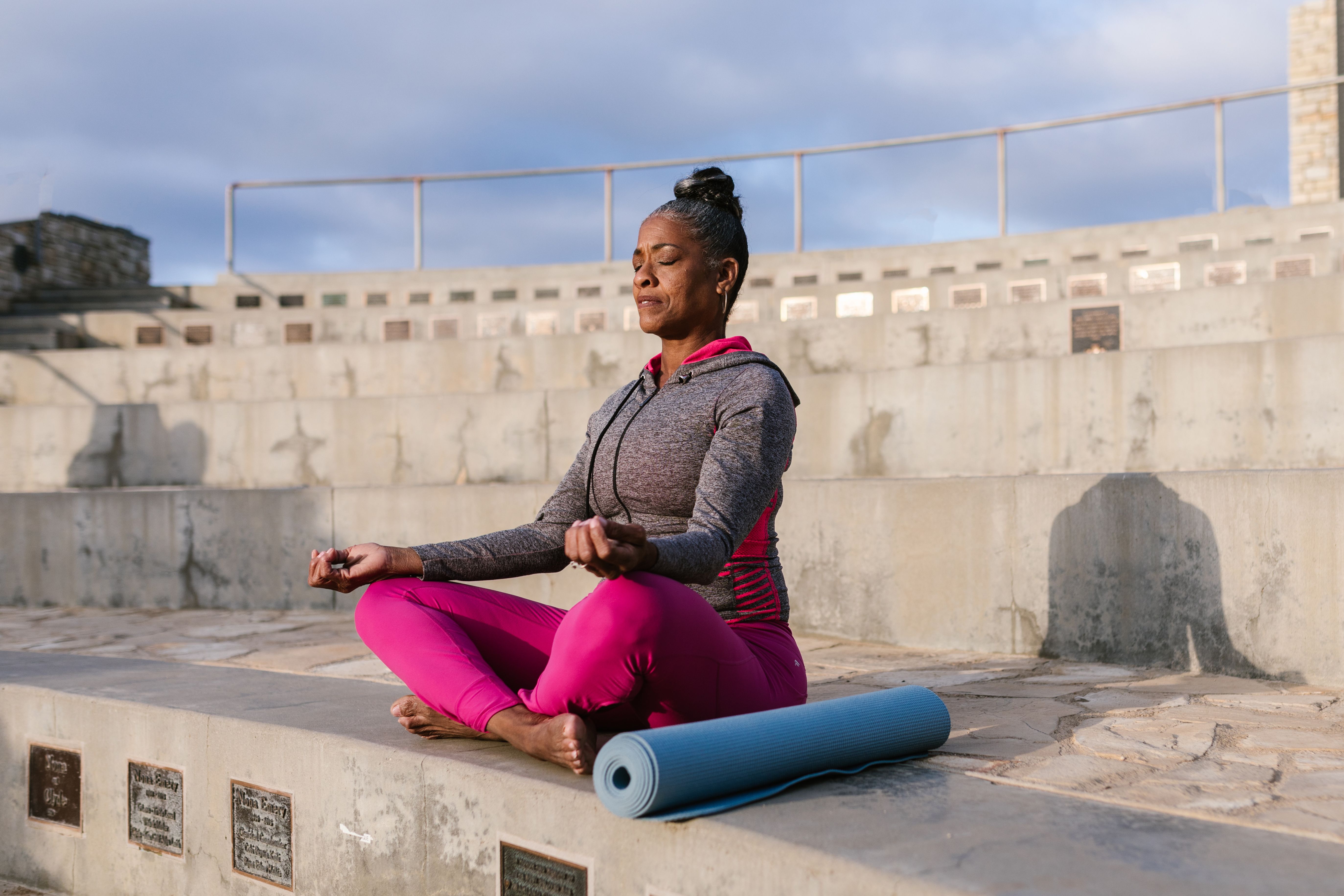 A Woman Holding Yoga Mat · Free Stock Photo