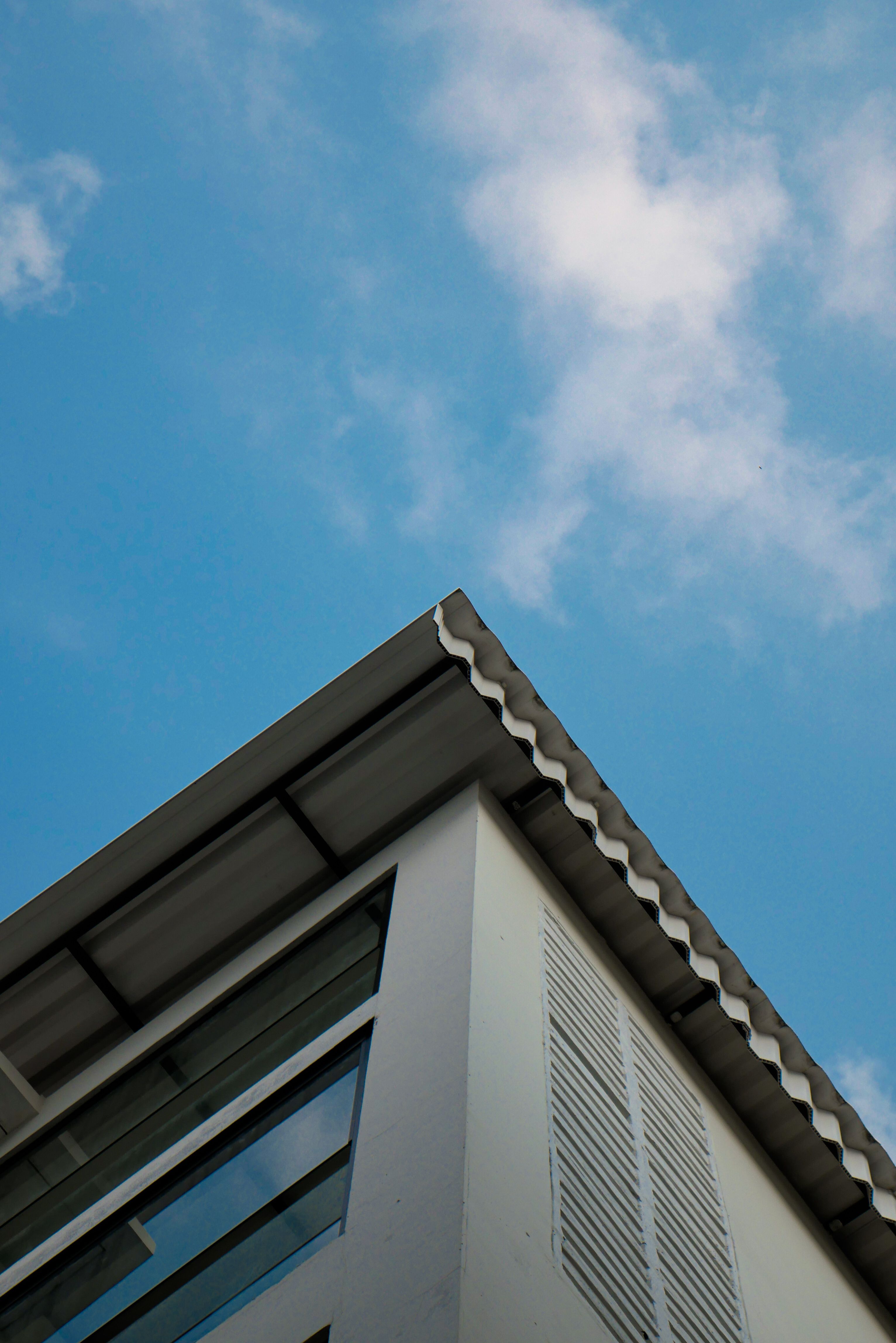Roof Corner Against Blue Sky · Free Stock Photo