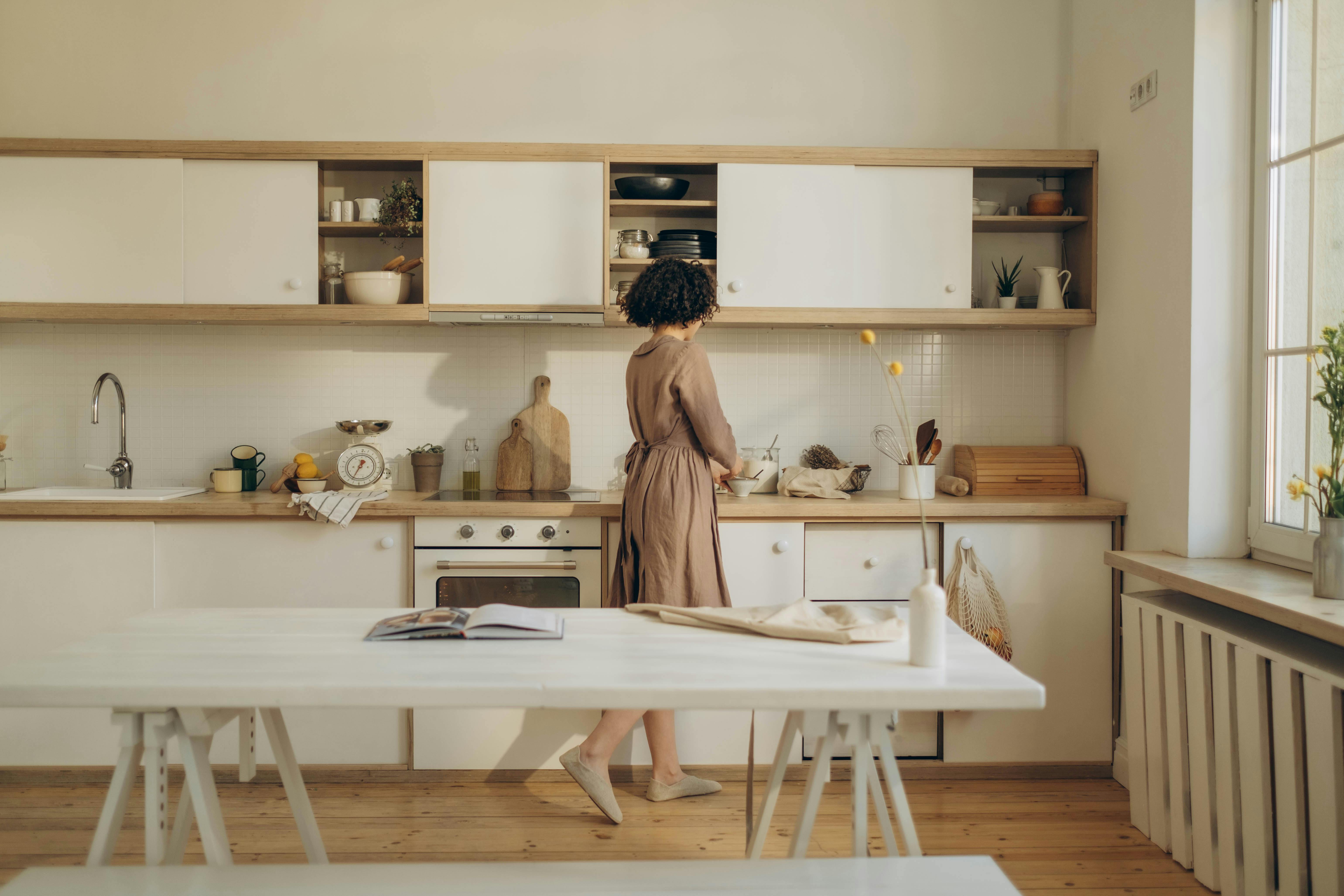 Back View Of A Woman At The Kitchen · Free Stock Photo