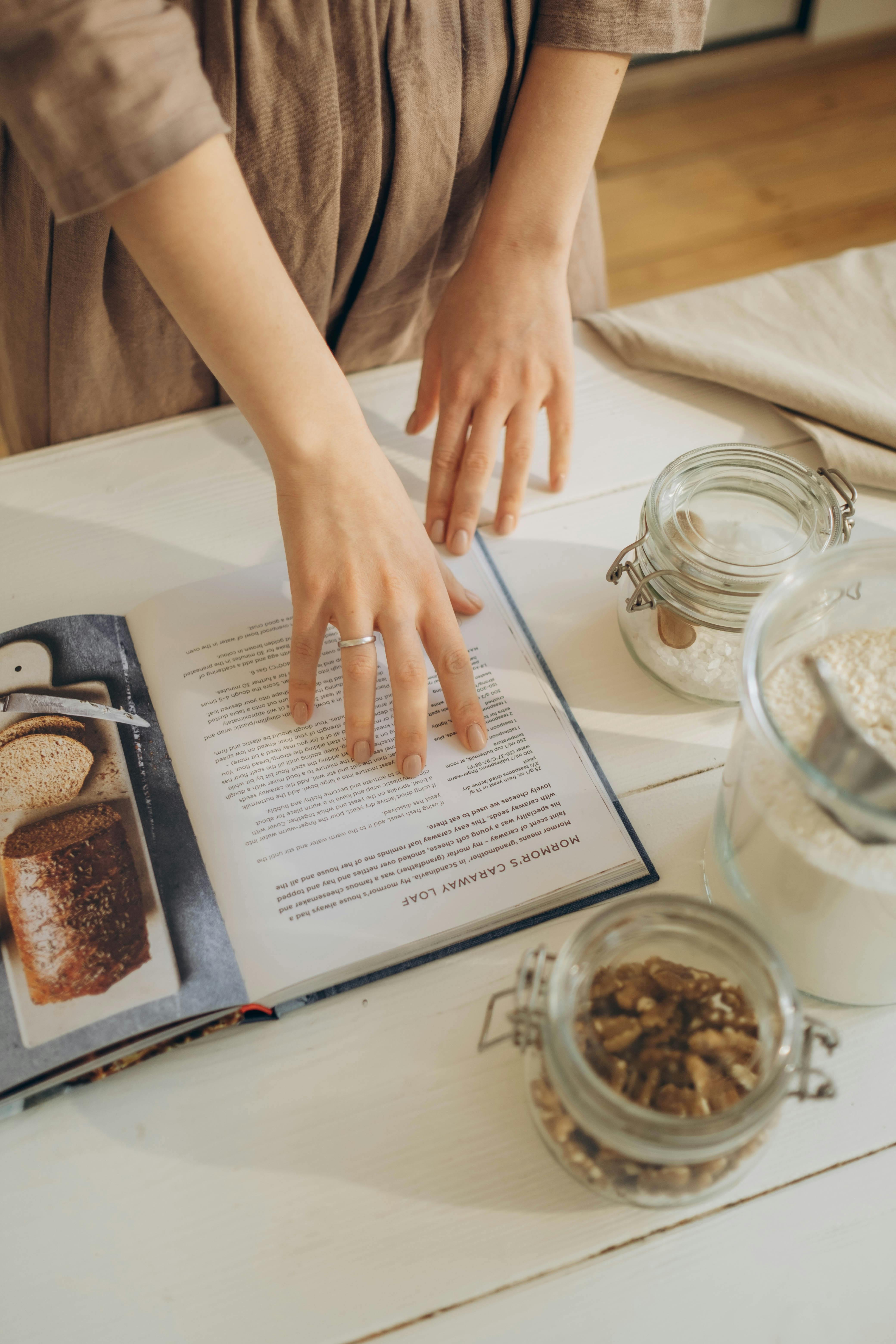 A Woman Reading a Cookbook · Free Stock Photo