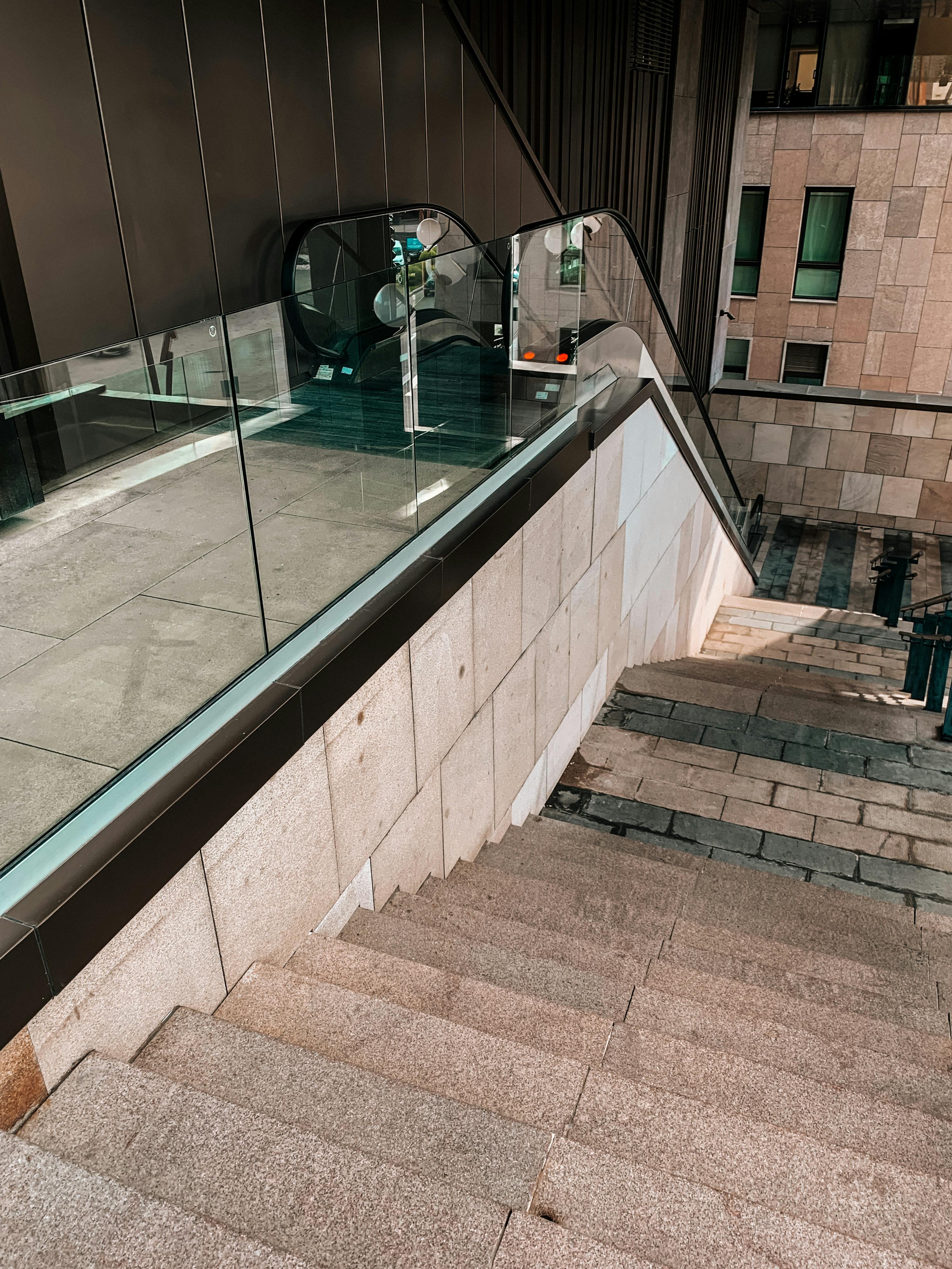 Glass Railing Along the Staircase and the Escalator · Free Stock Photo