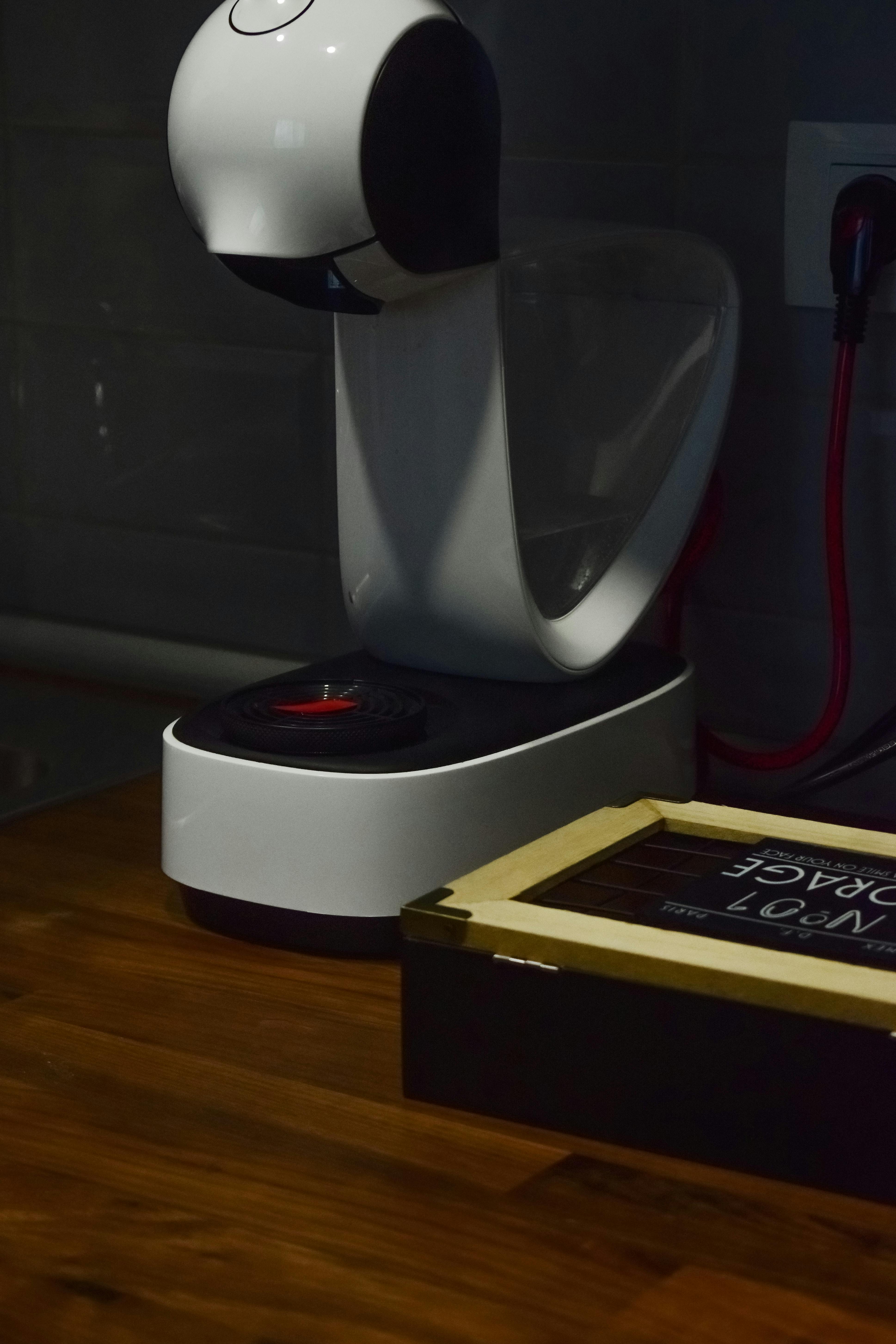 Coffee Machine and a Container on a Counter Top · Free Stock Photo