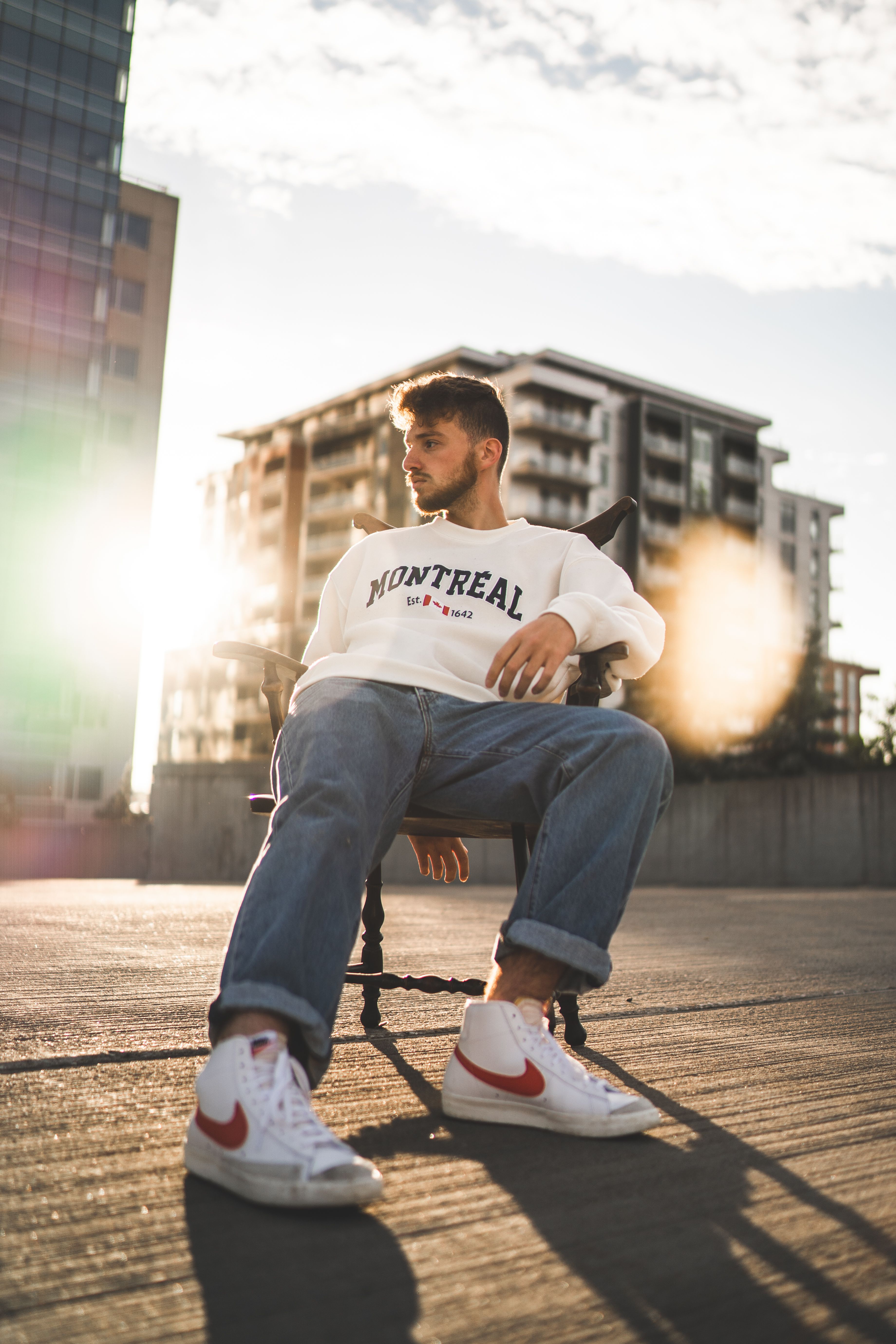 Man Model Sitting on Column · Free Stock Photo