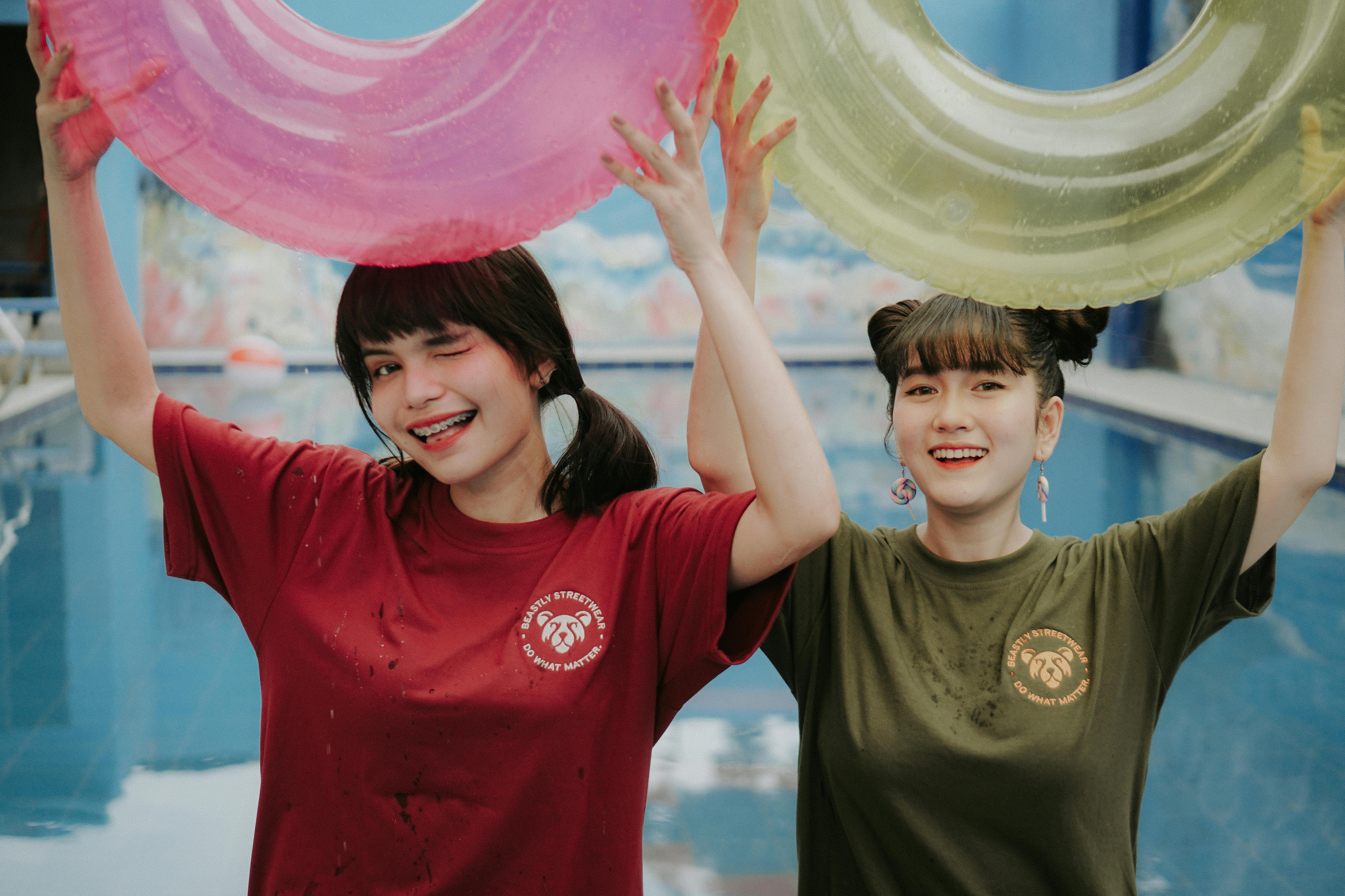 Teenage Girls Holding Floaters · Free Stock Photo