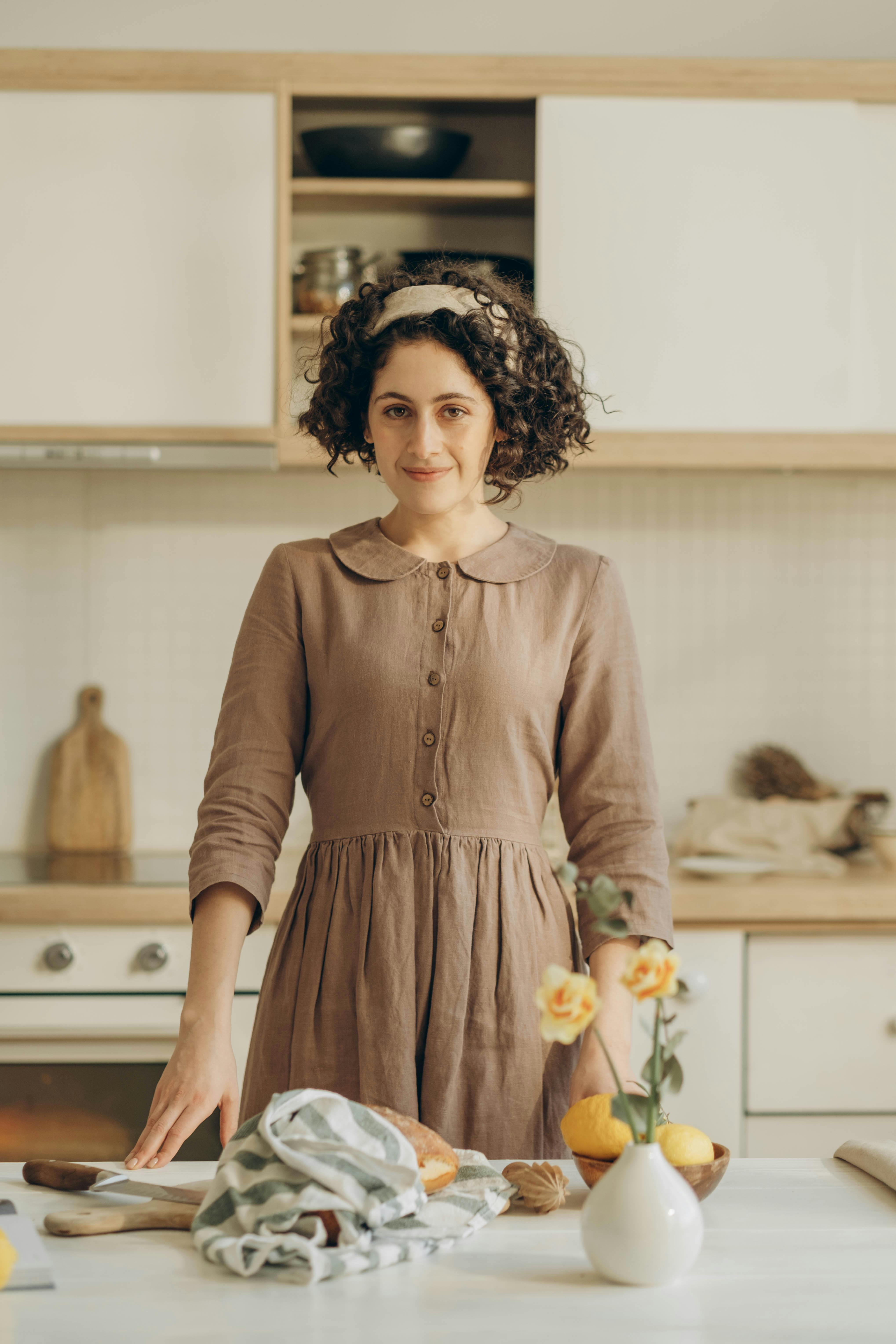 Curly Haired Woman in the Kitchen · Free Stock Photo