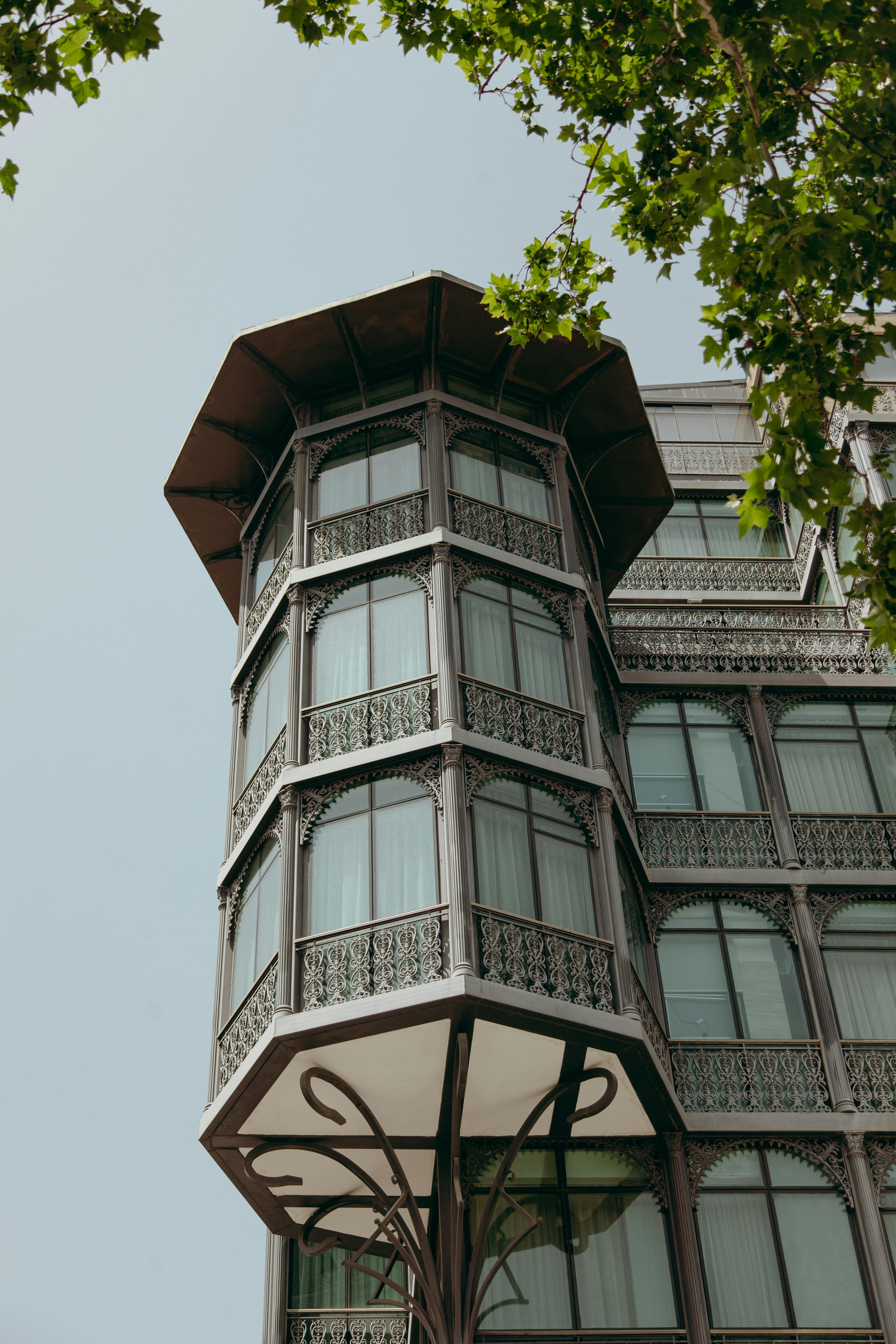 Low Angle Shot of Building with Arched Glass Windows · Free Stock Photo