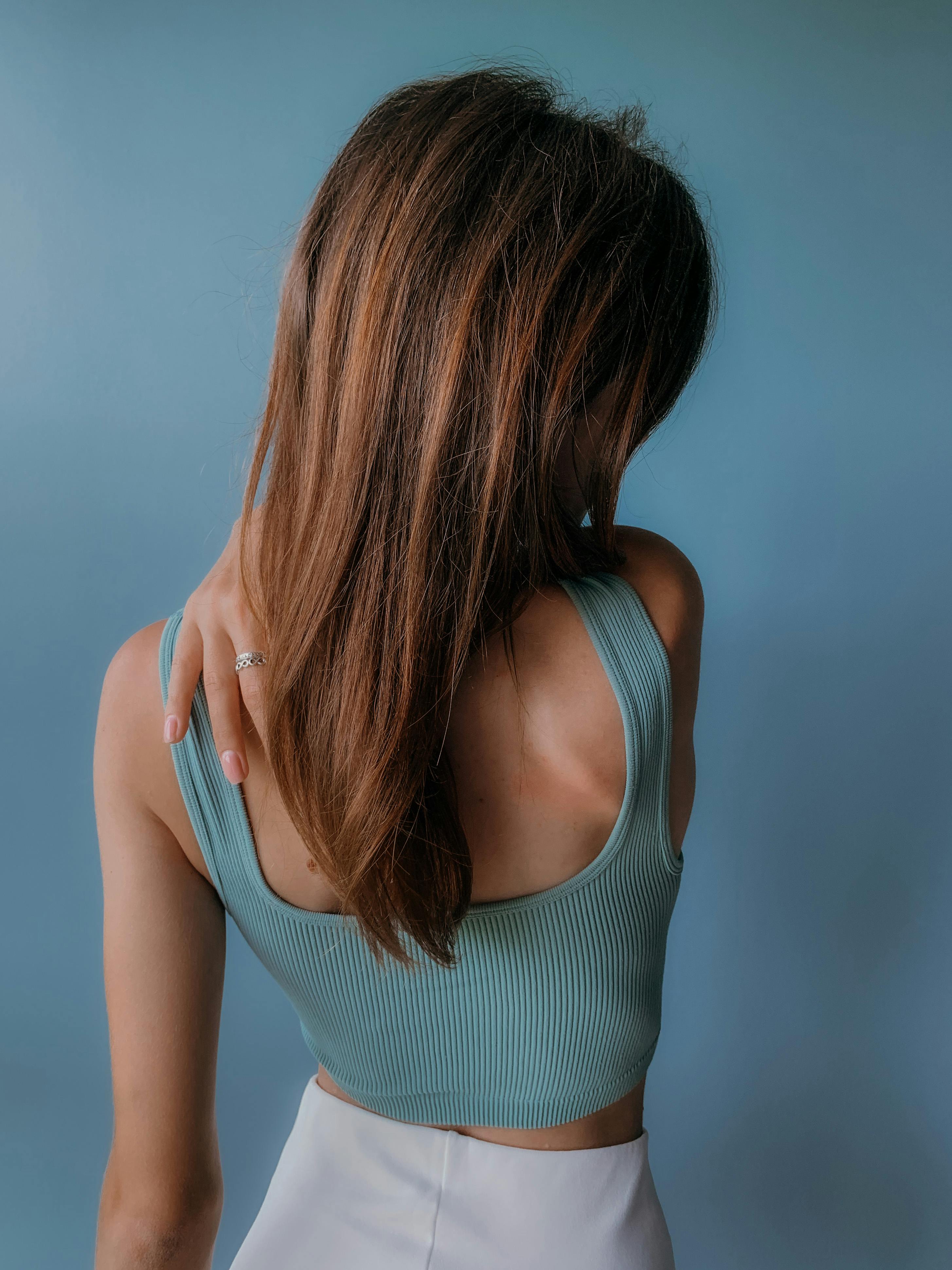Back View of a Woman Posing in a Studio · Free Stock Photo