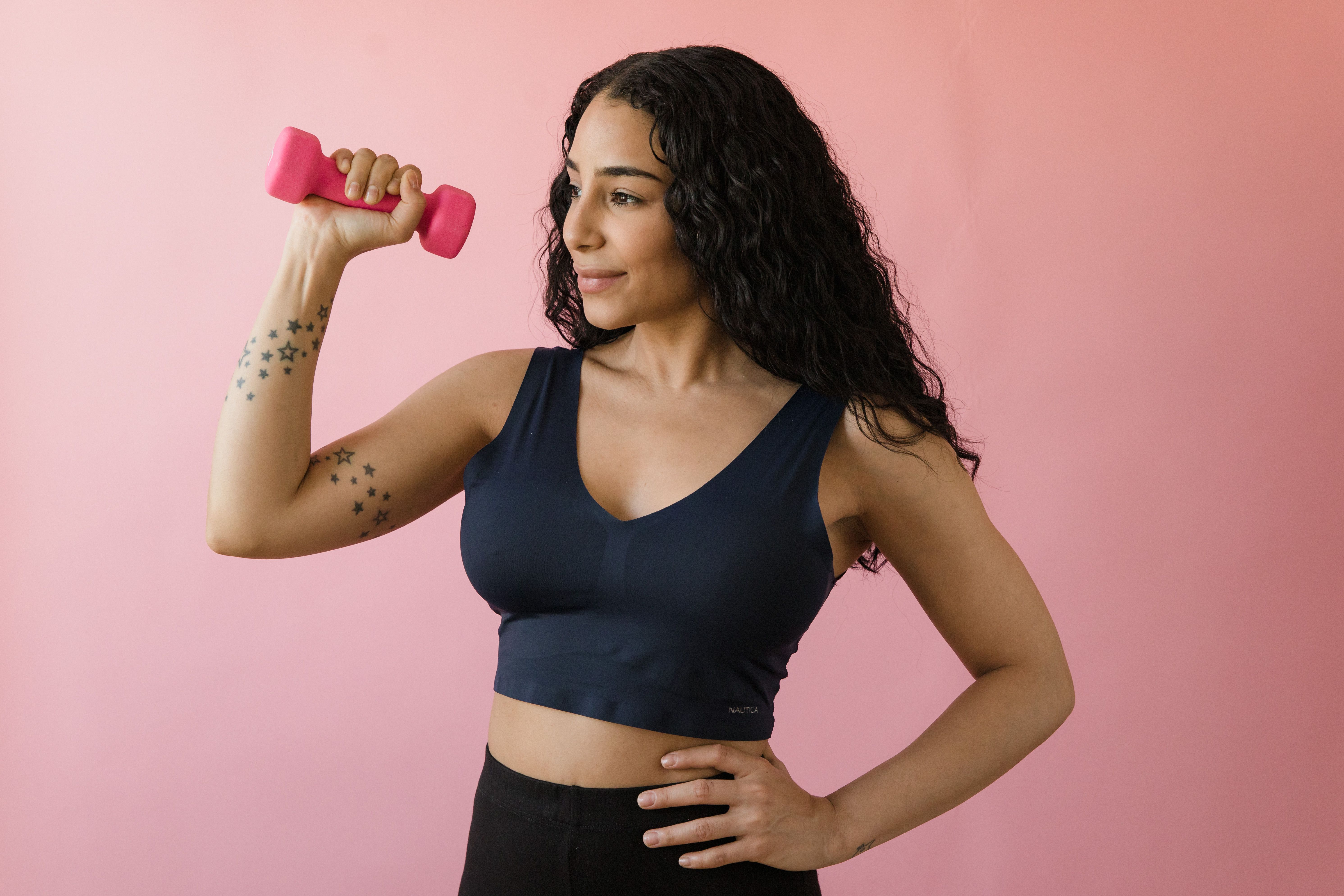 A Person Lifting a Dumbbell · Free Stock Photo