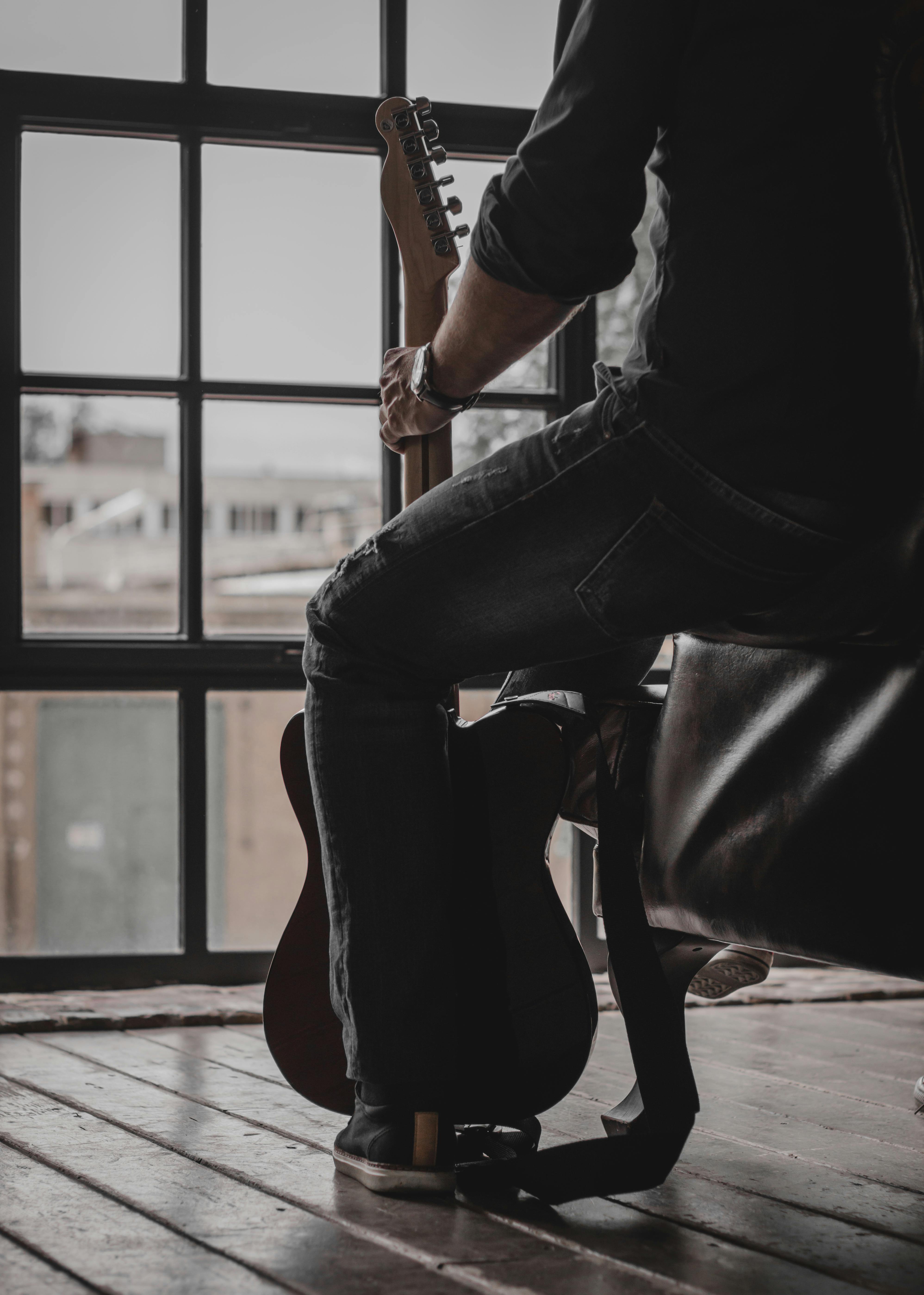Guitar Beside Window · Free Stock Photo