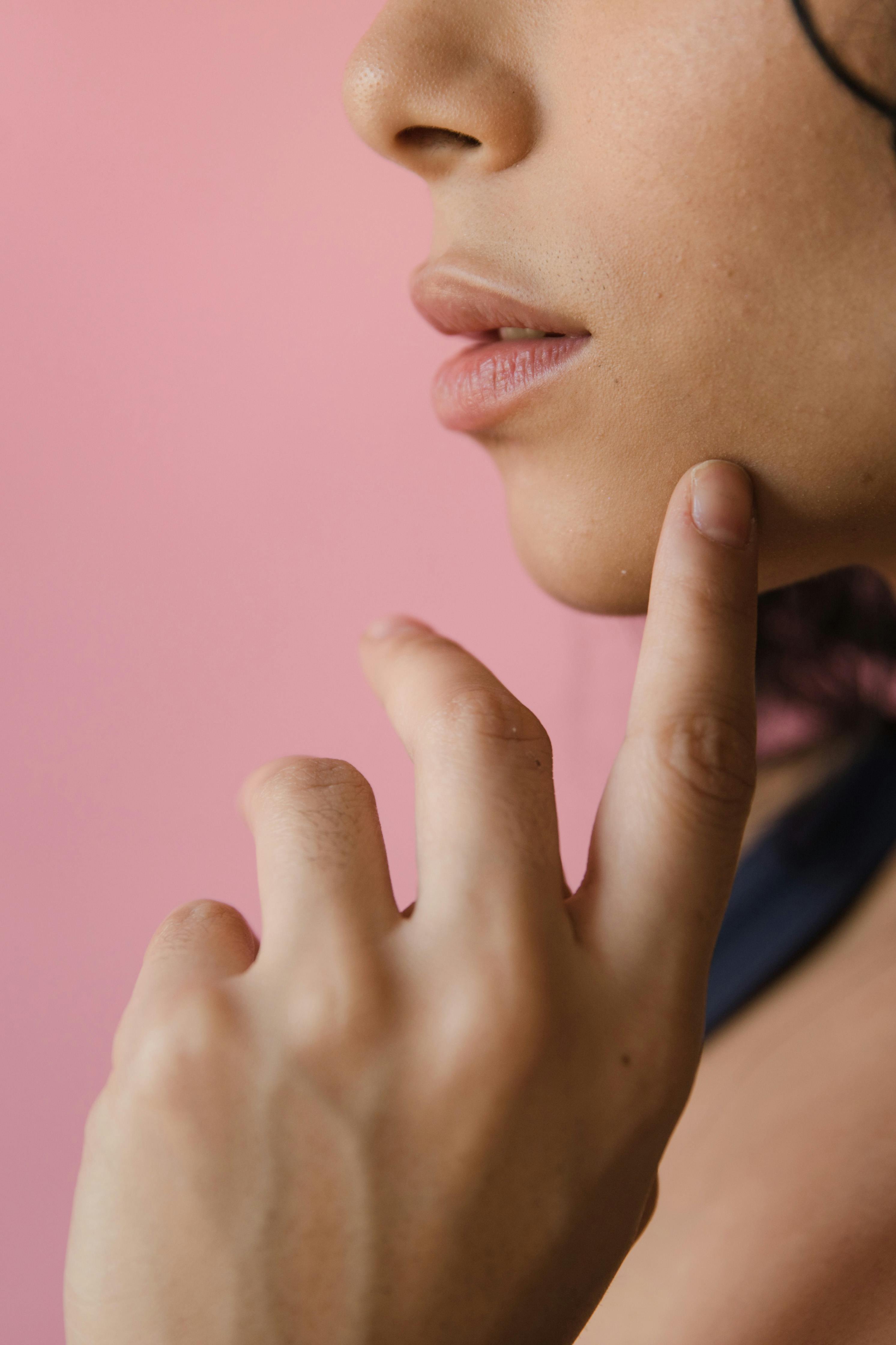 A Woman Touching Her Chin · Free Stock Photo