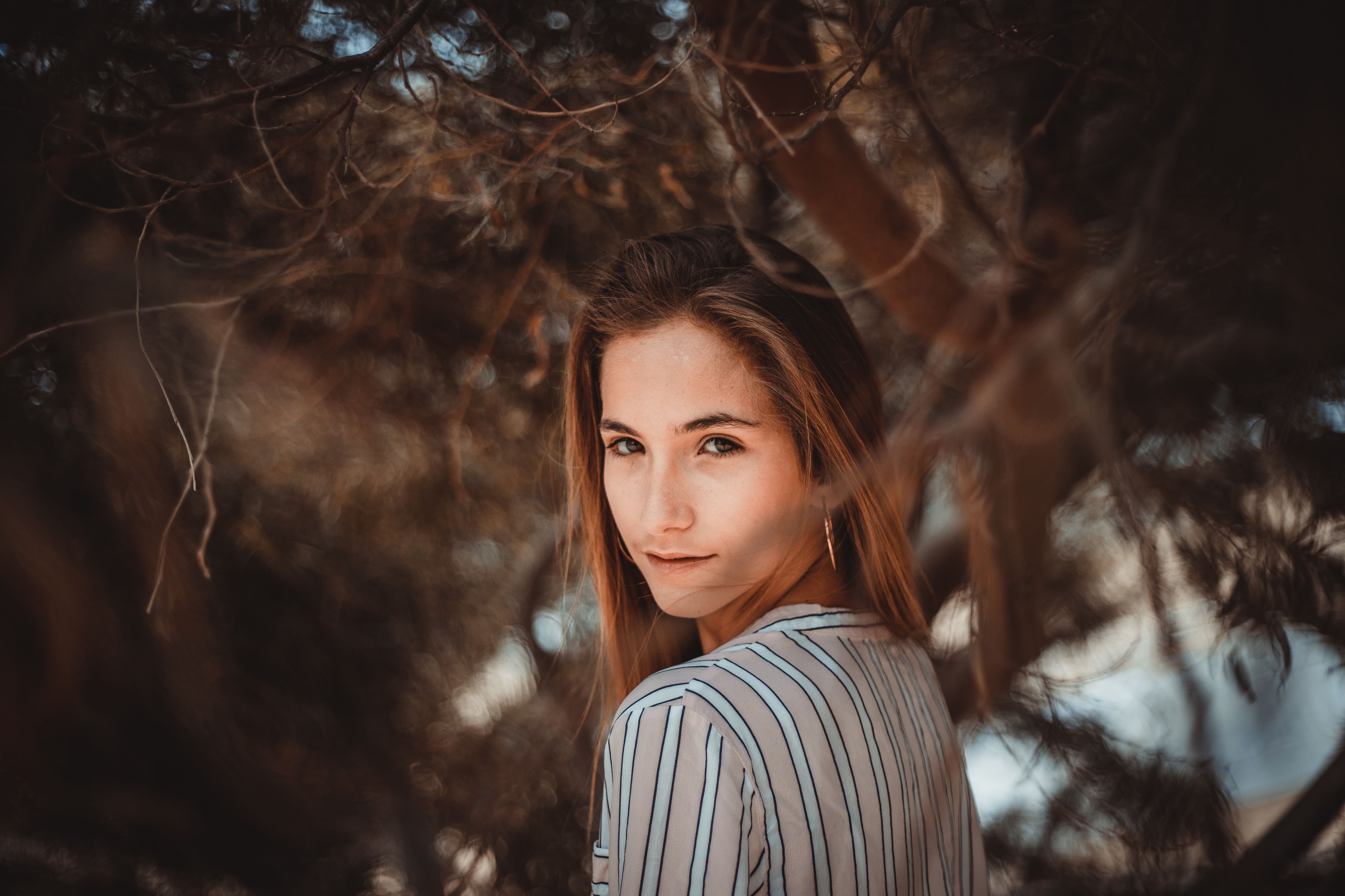 Beautiful Woman Looking Over her Shoulder · Free Stock Photo