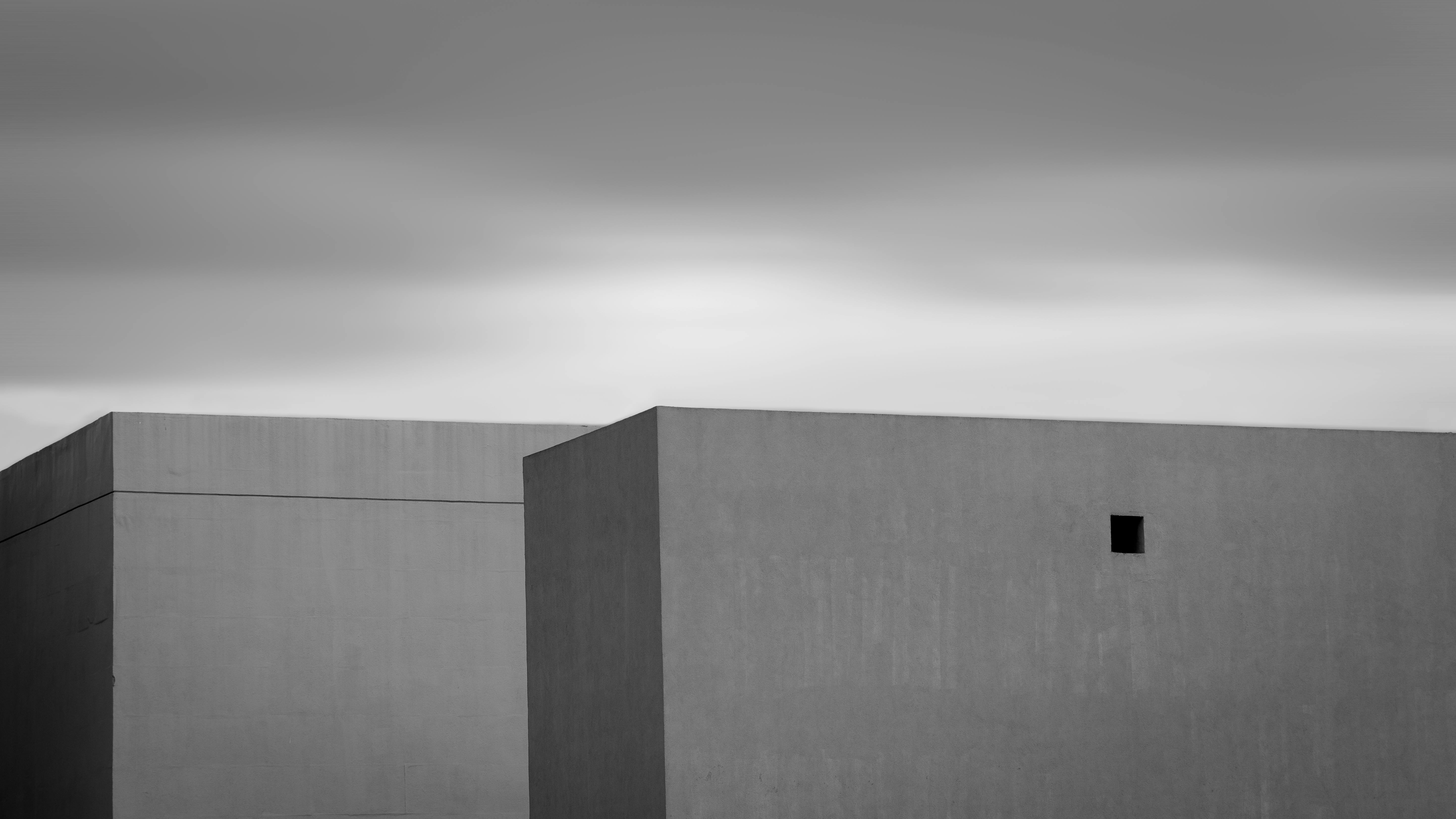 Gray Scale Photo of a Building · Free Stock Photo