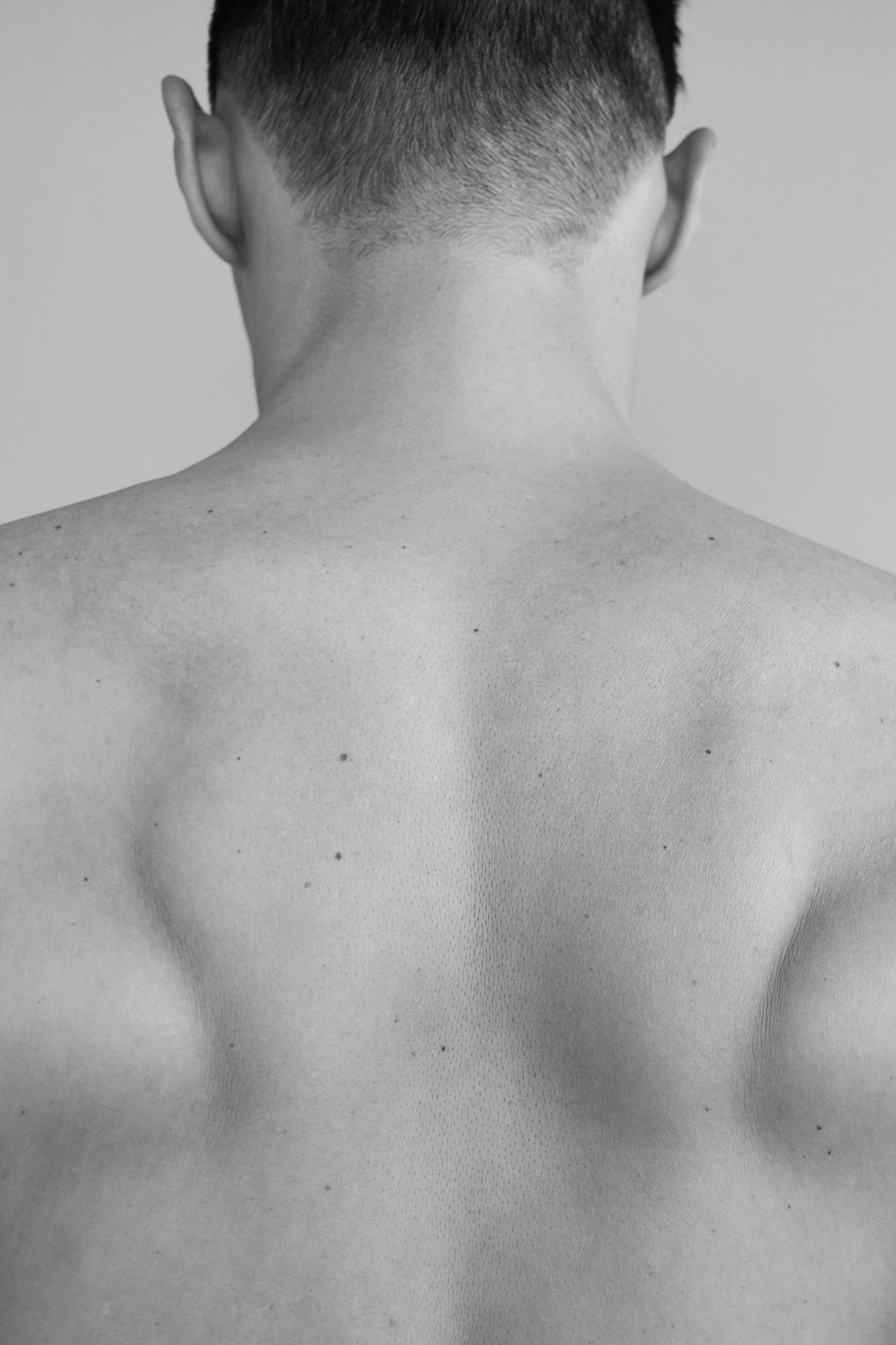 Back and Neck of a Shirtless Man · Free Stock Photo