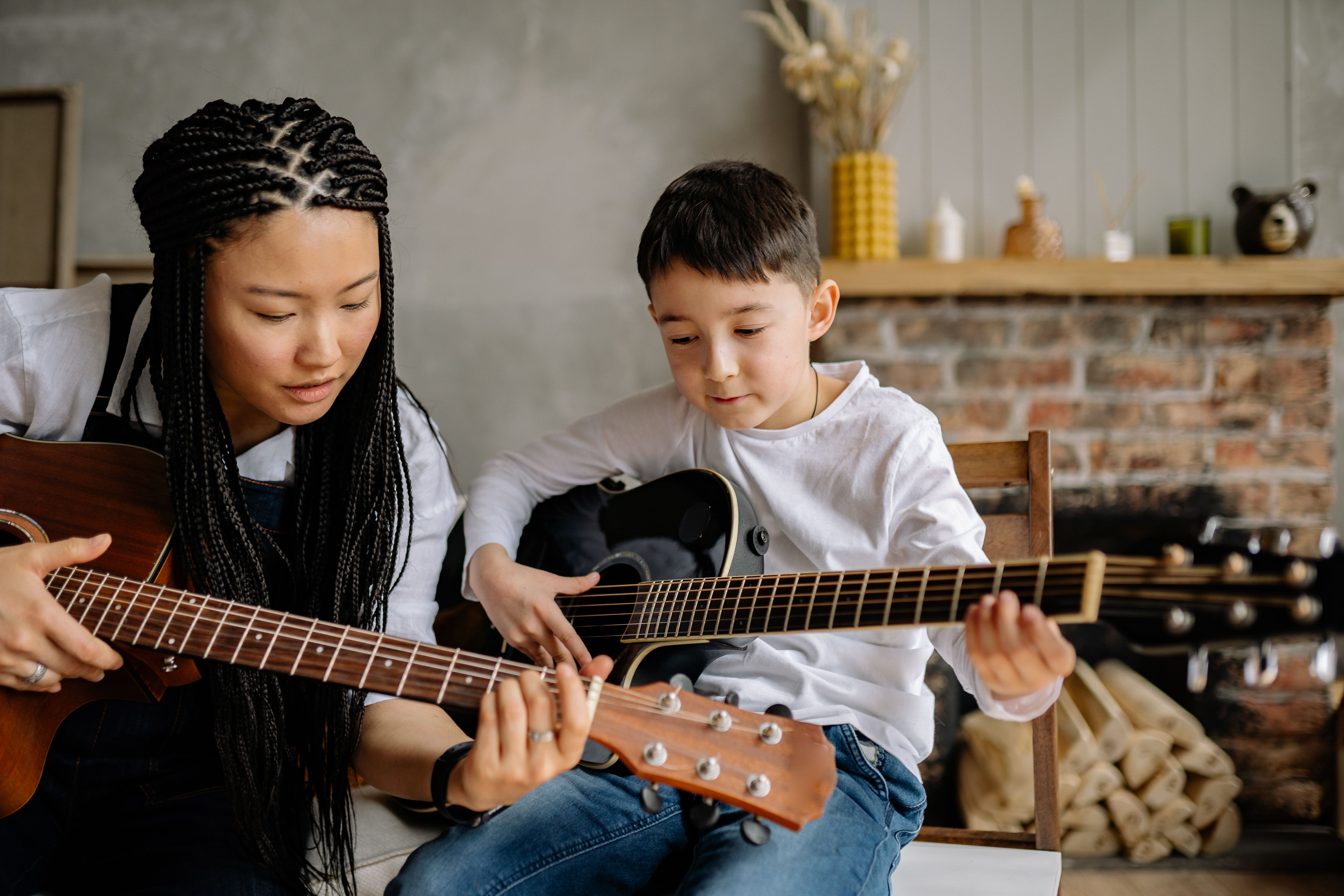 A Cute Girl Playing Ukulele · Free Stock Photo