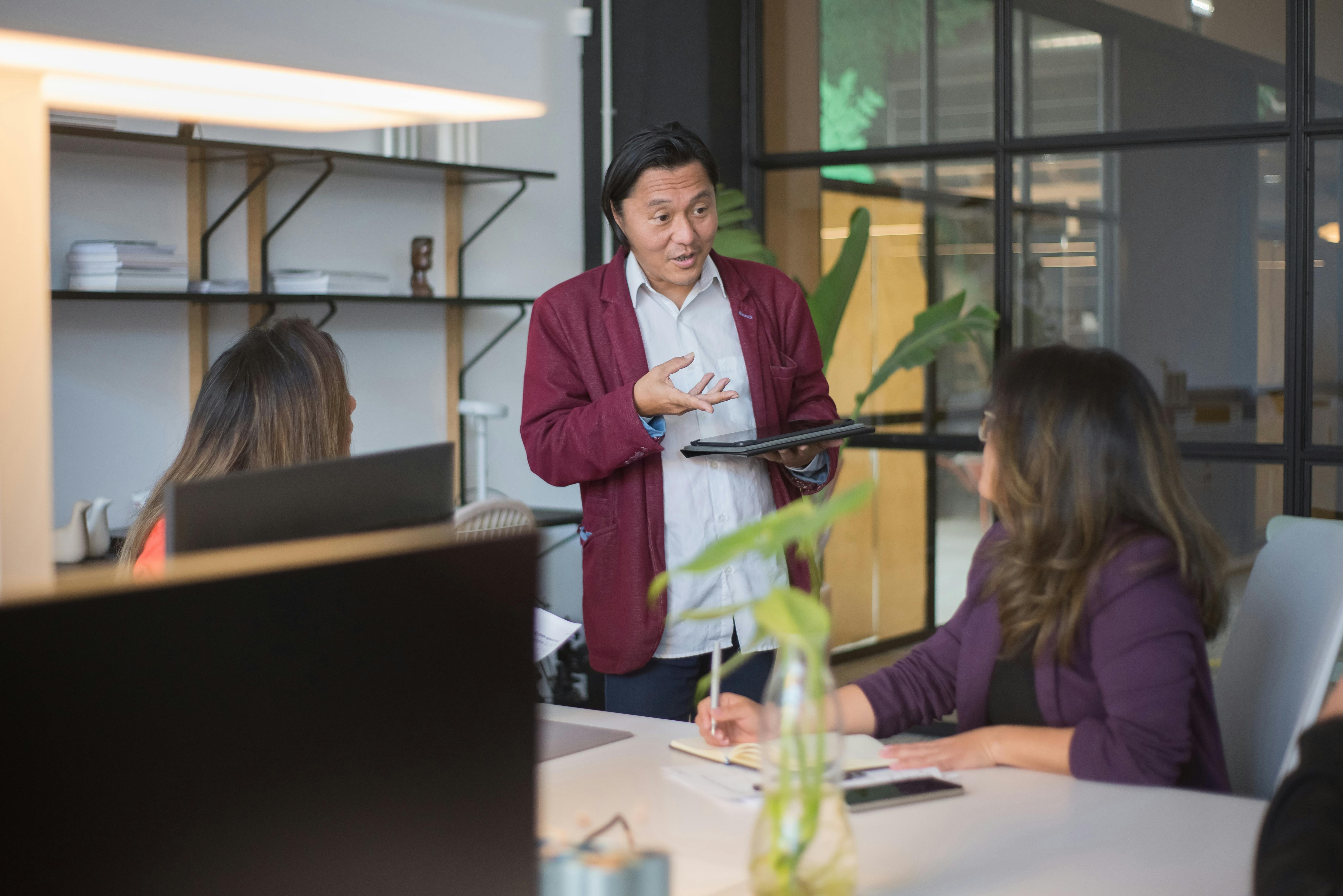 People Talking in Well-lit Room · Free Stock Photo