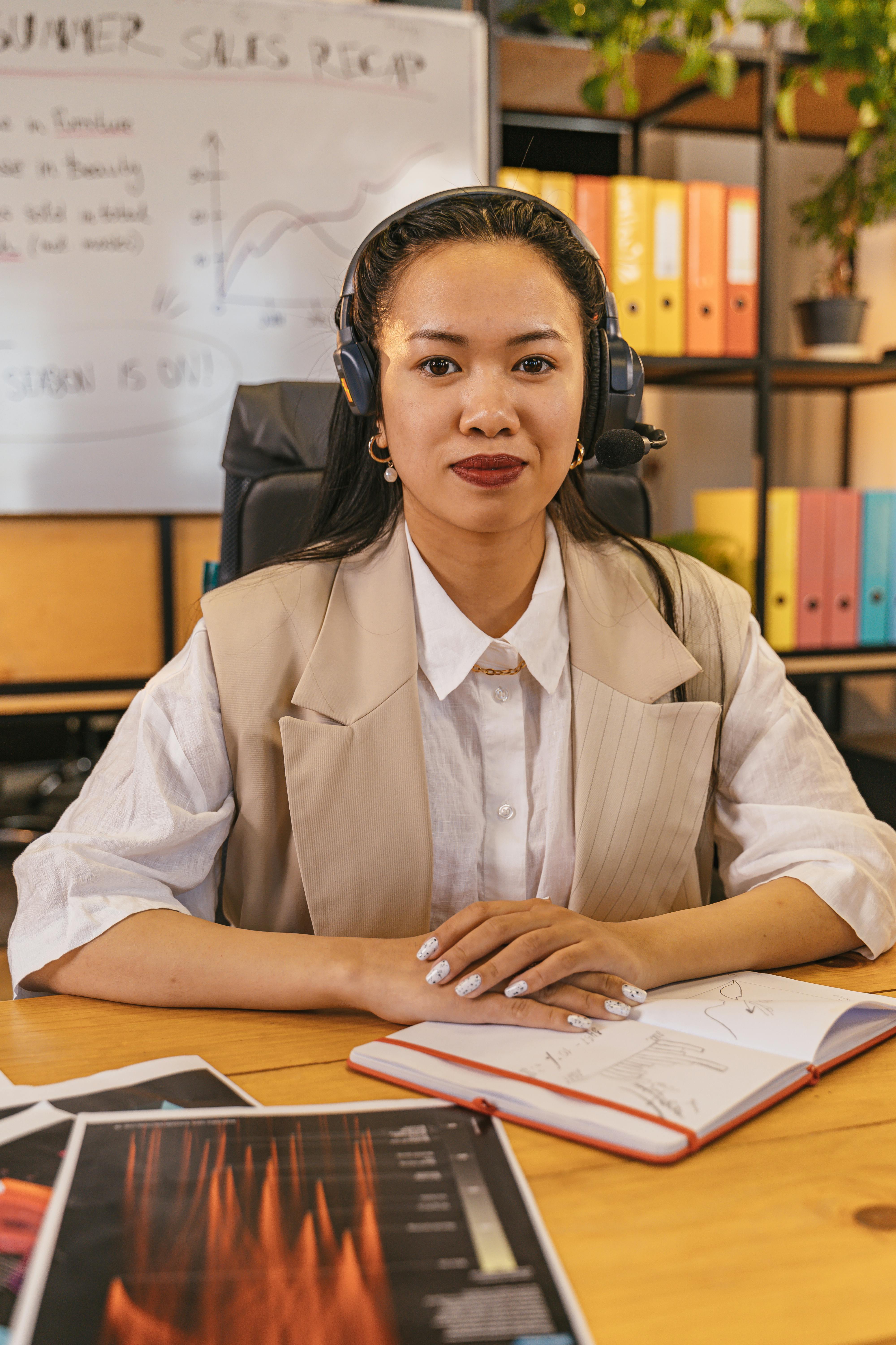 Pretty woman Wearing a Robe Holding Books · Free Stock Photo