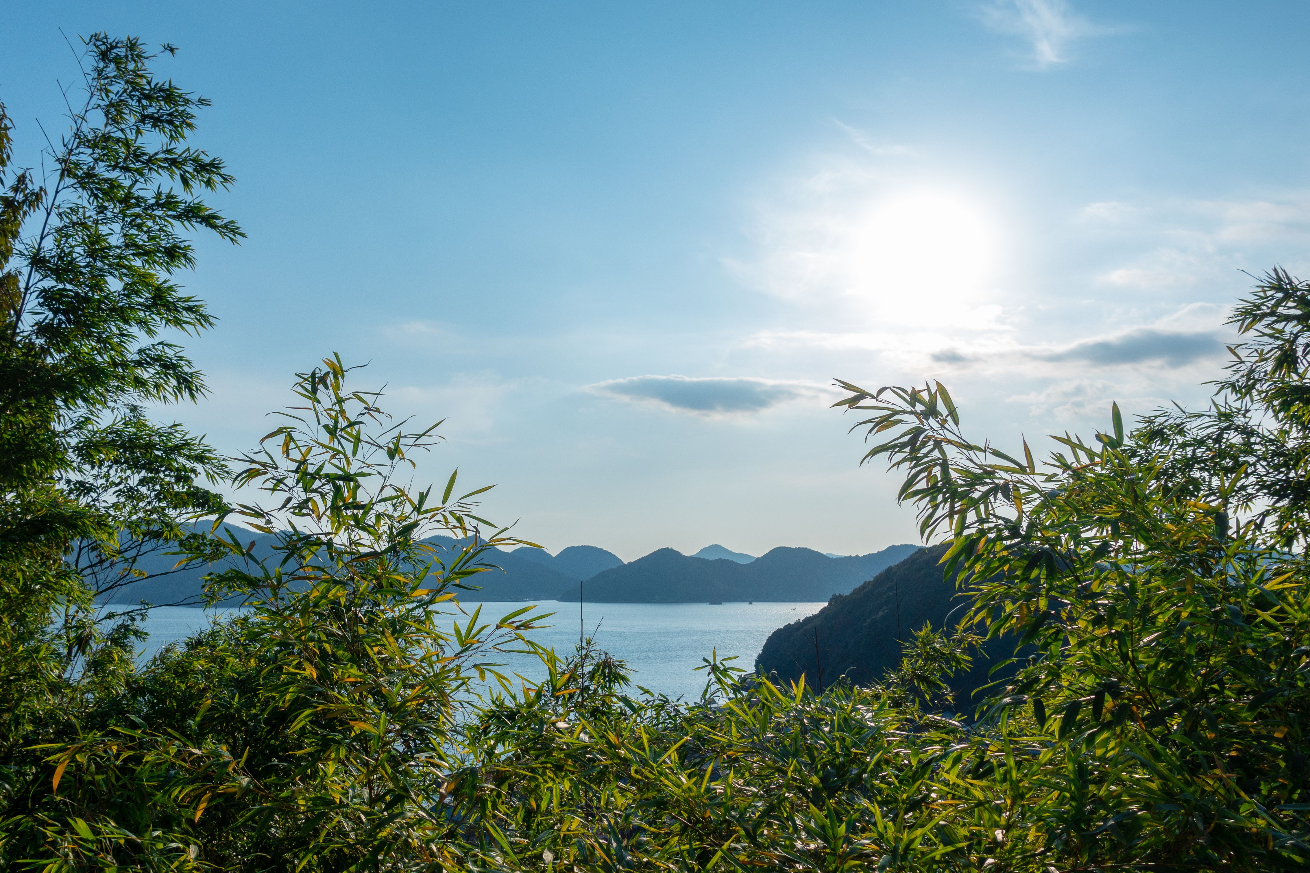 Bright Sun over Mountains and Sea · Free Stock Photo