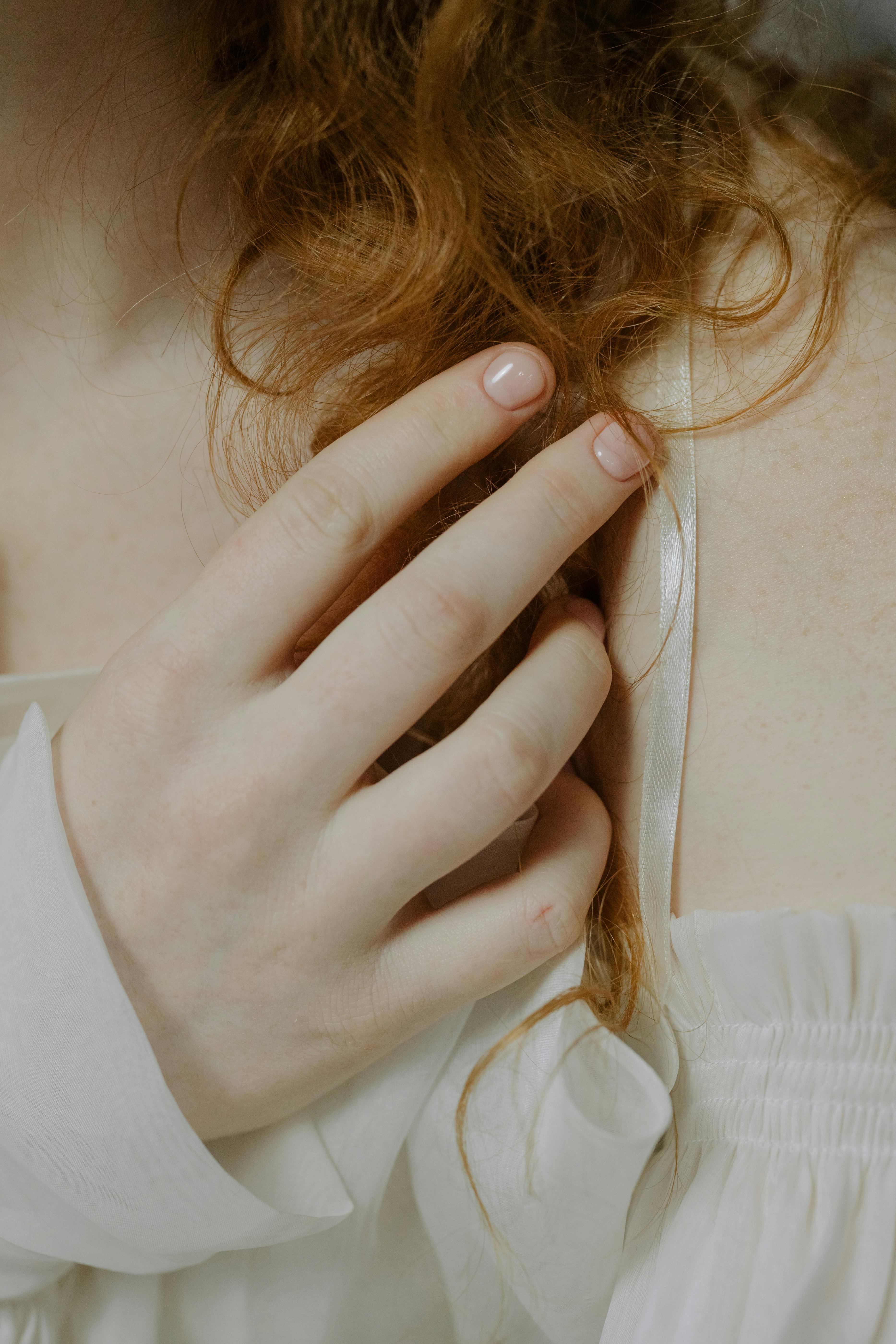 A Woman Touching Her Hair · Free Stock Photo