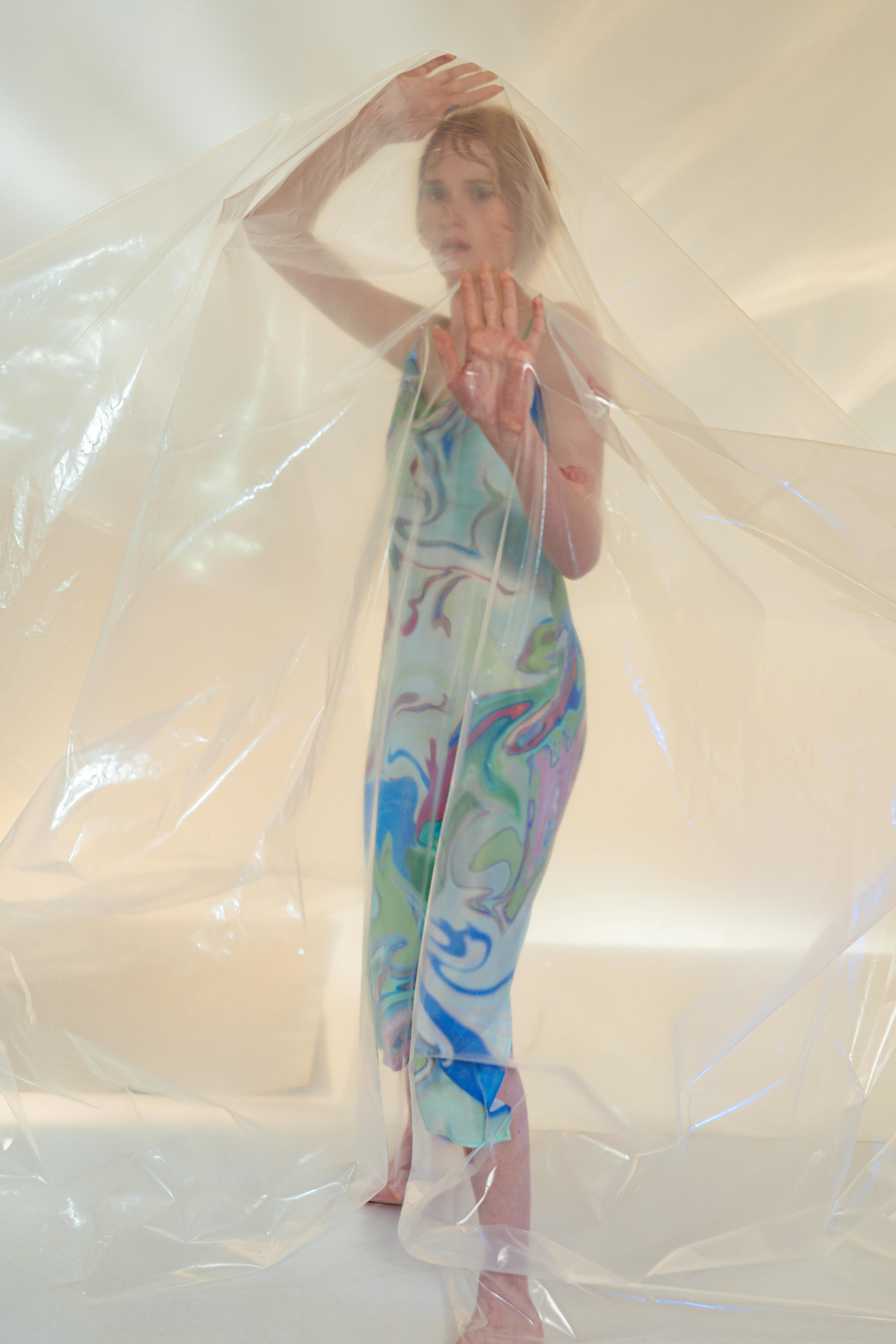 Woman Trapped under Transparent Plastic Foil · Free Stock Photo