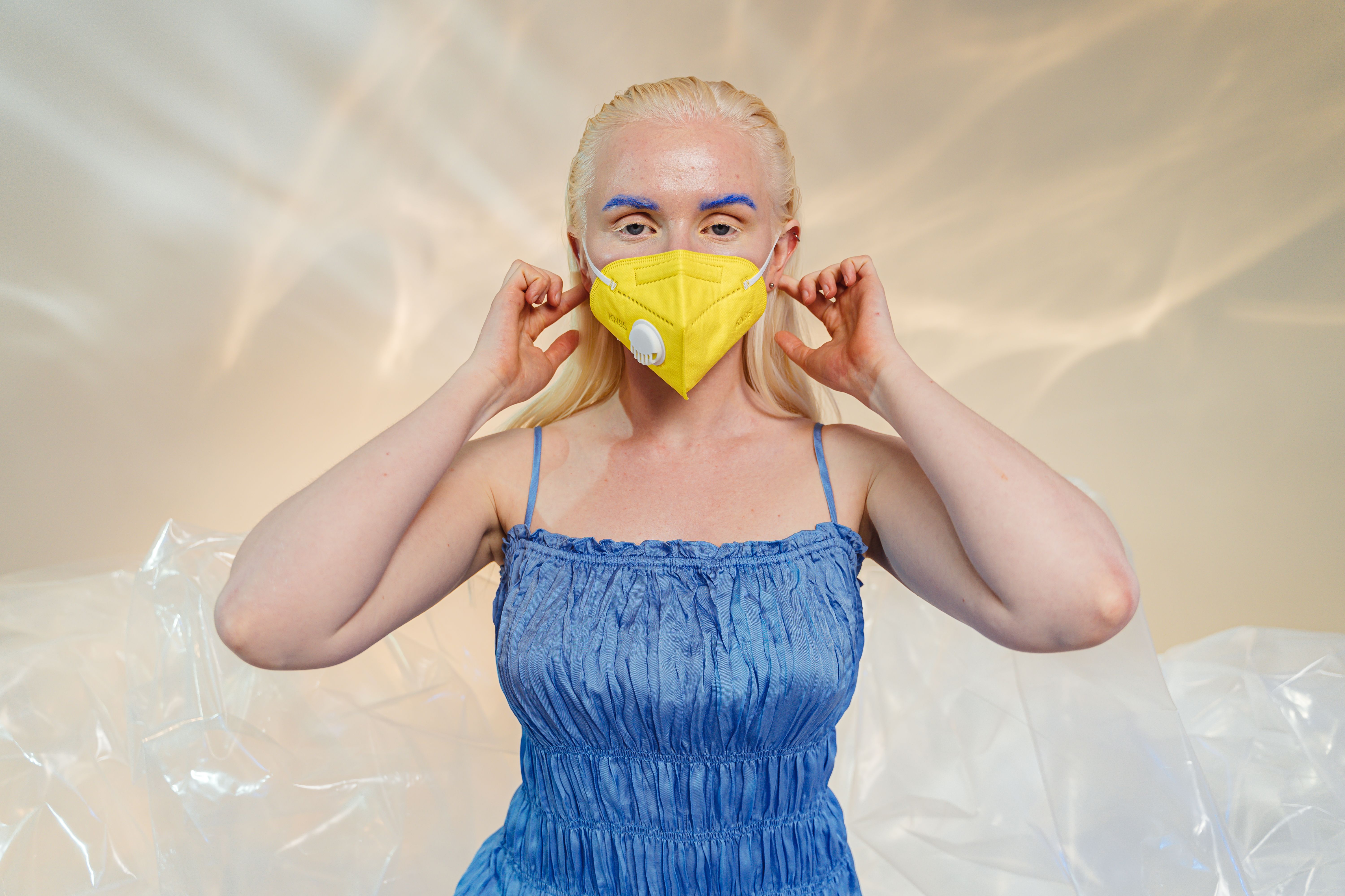 Woman Wearing a Yellow Face Mask · Free Stock Photo