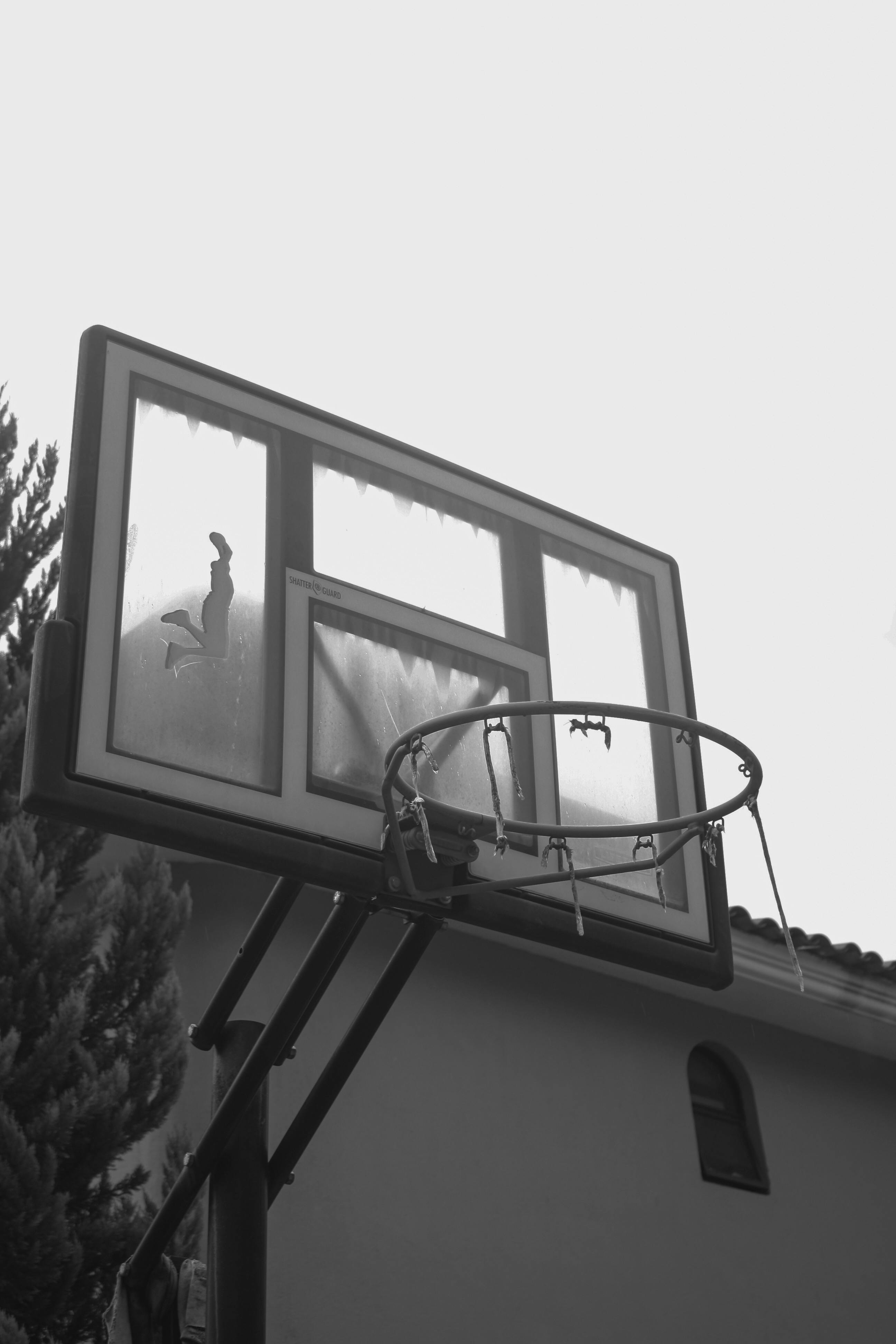 A Grayscale Photo of a Basketball Ring · Free Stock Photo
