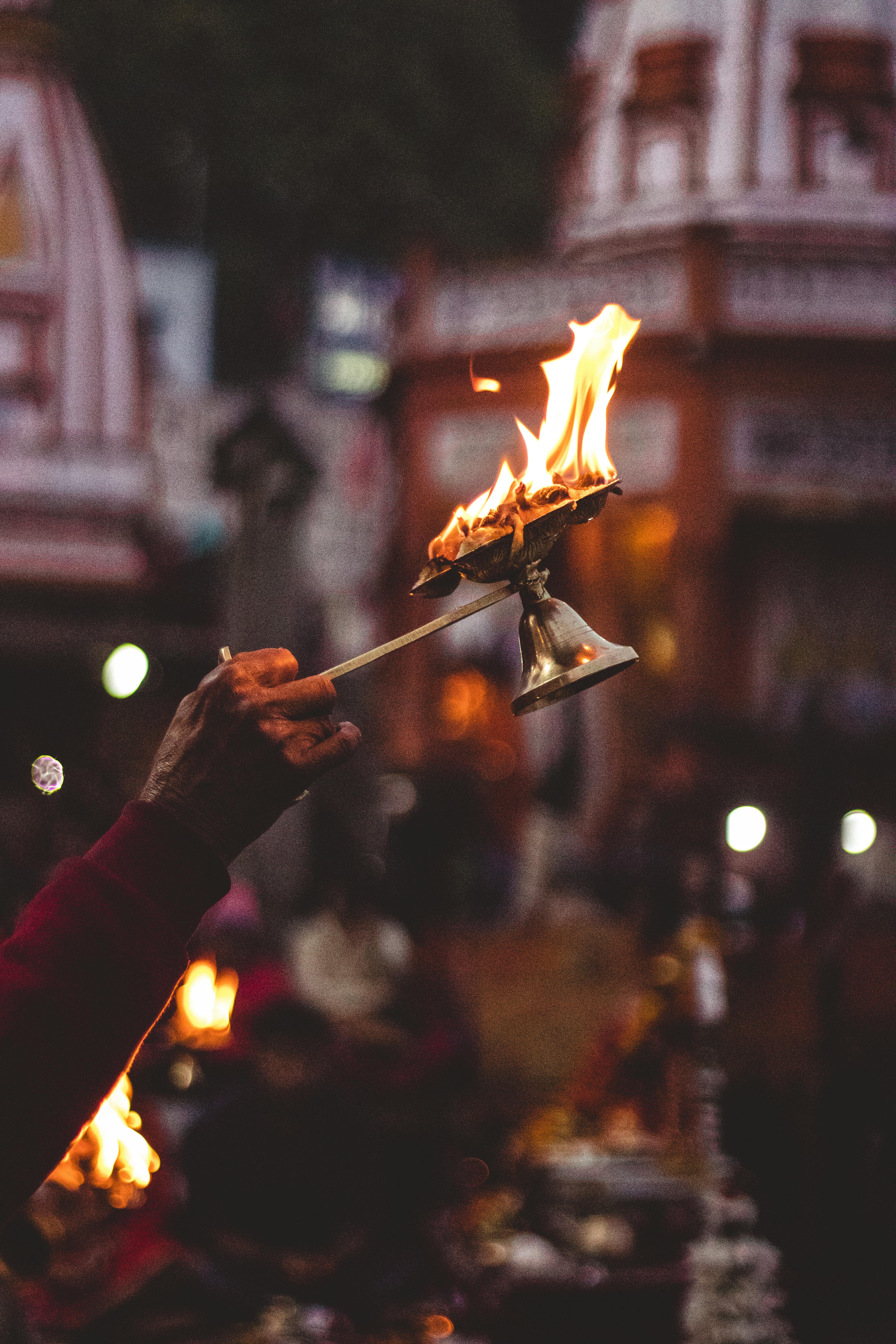 Person Holding Lamp With Flame · Free Stock Photo