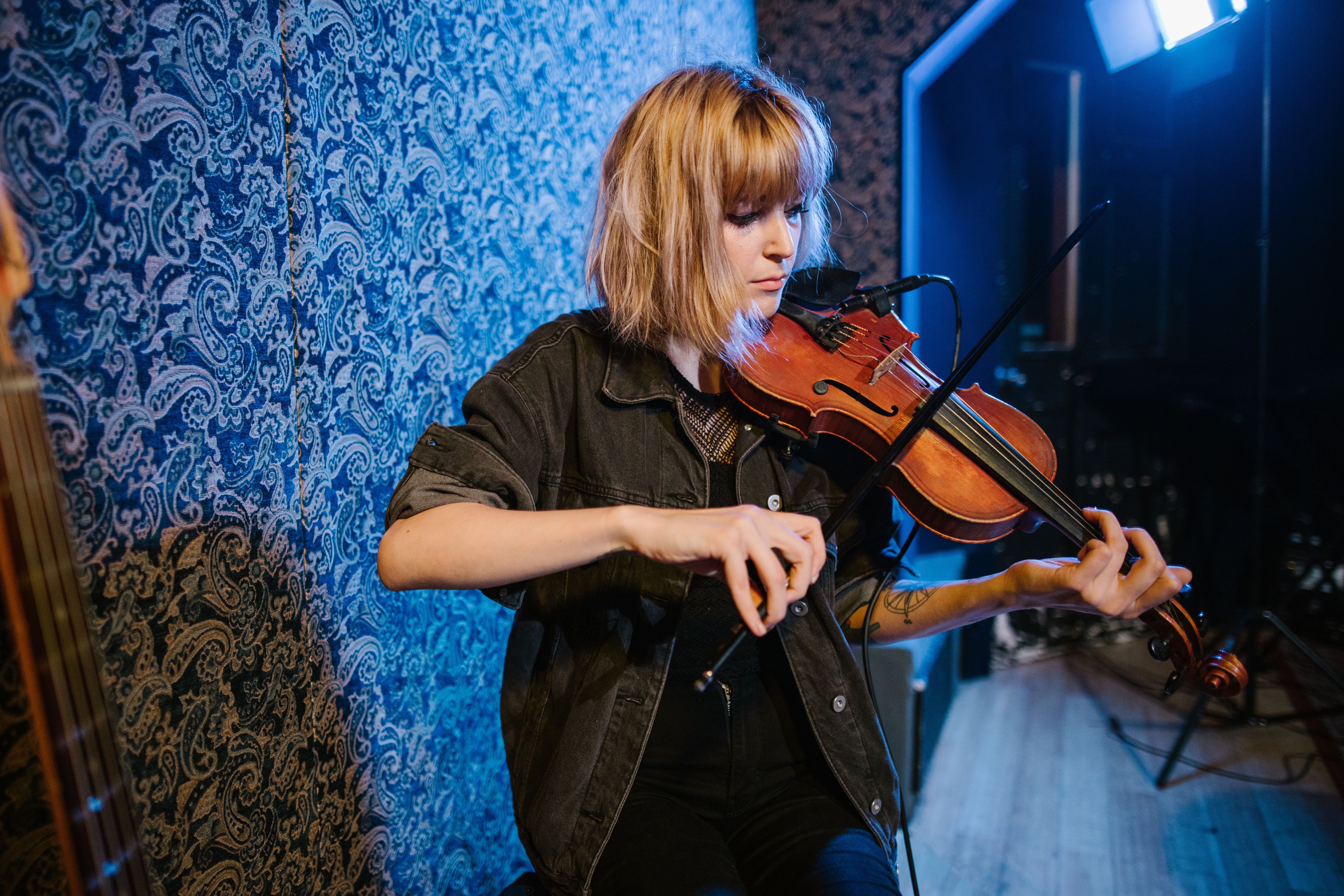 Woman in Black Jacket Playing Violin · Free Stock Photo