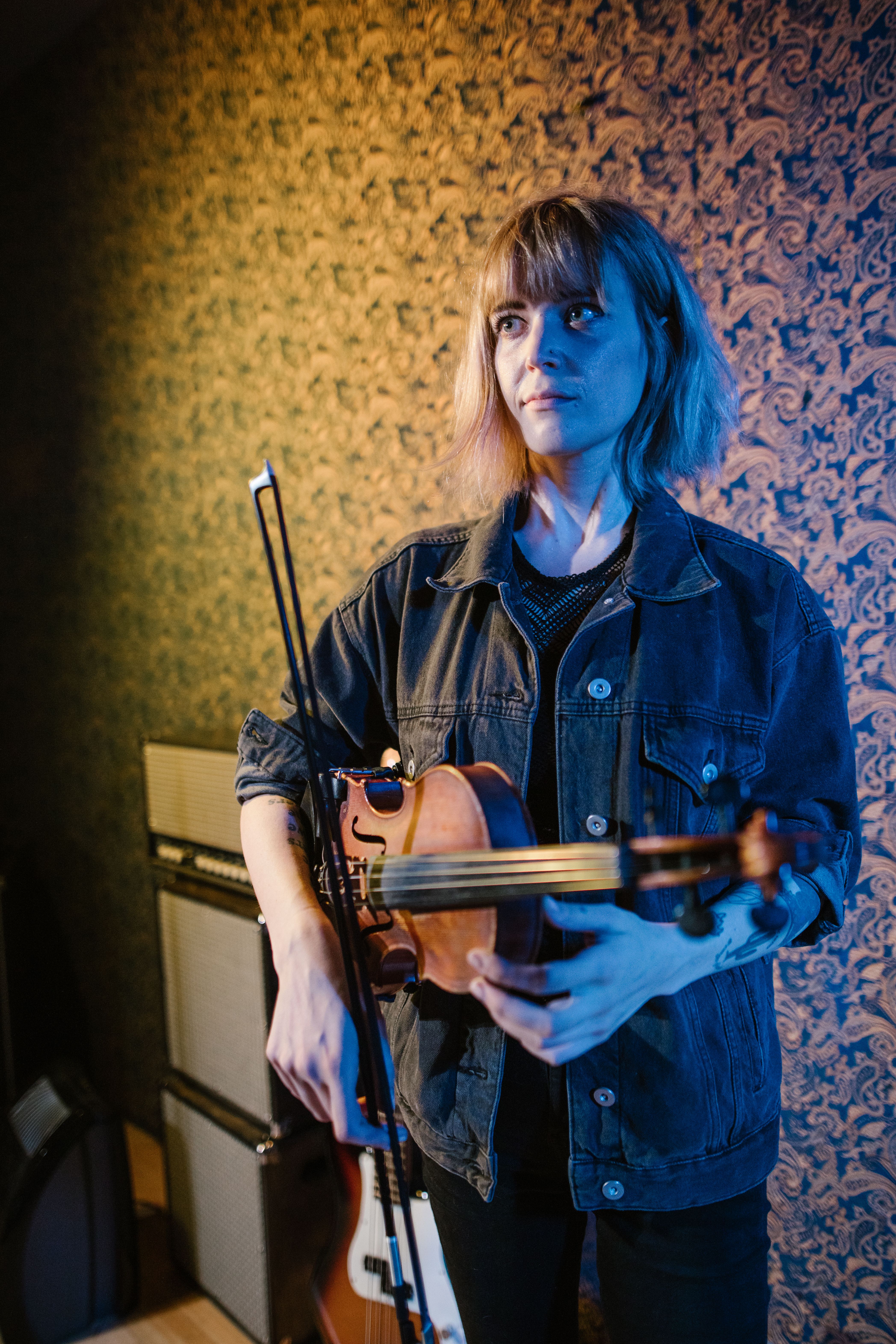 Woman in Denim Jacket Holding Violin · Free Stock Photo